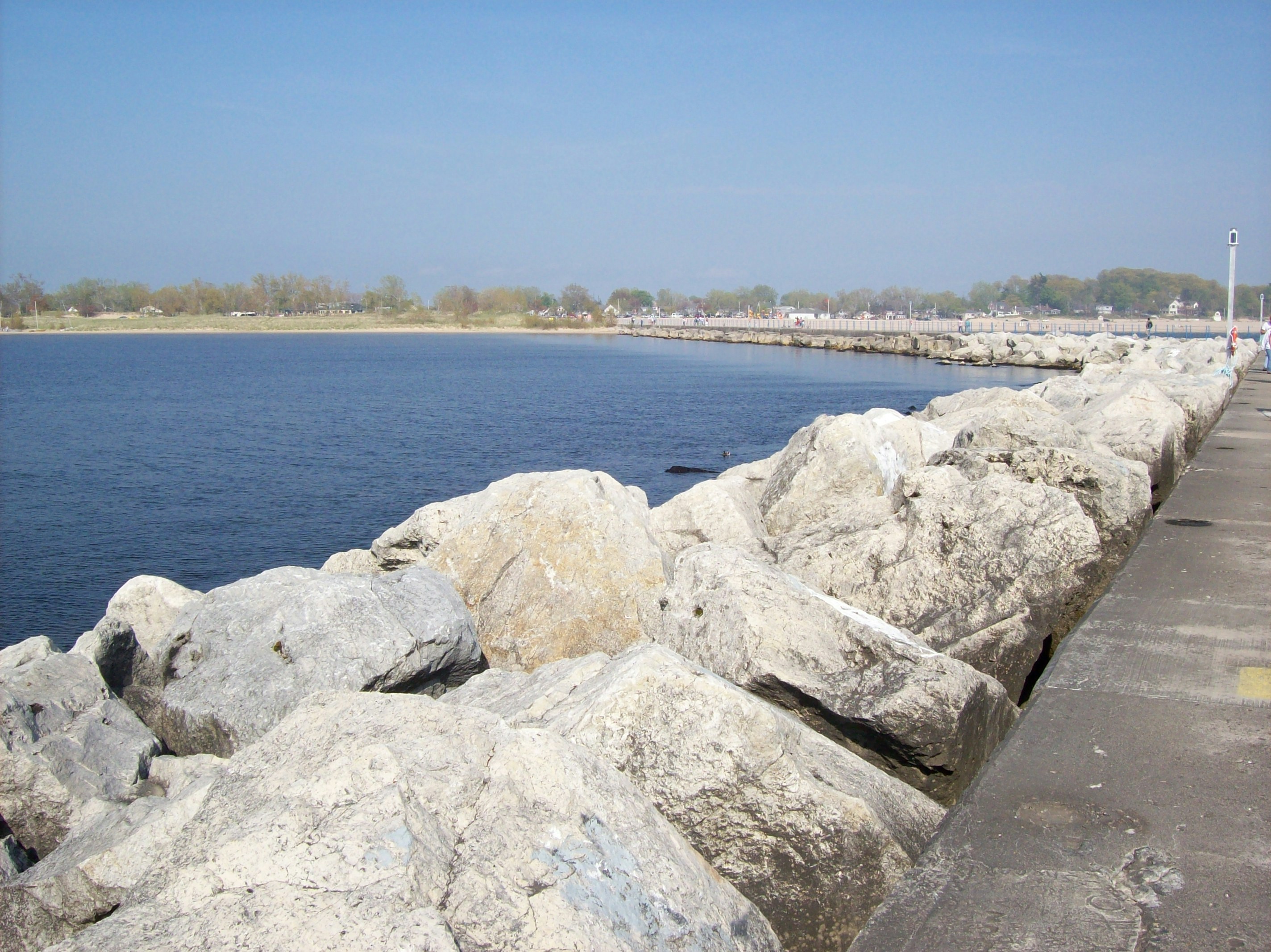 Rocky Breakwater Reaching Toward a Calm Harbor