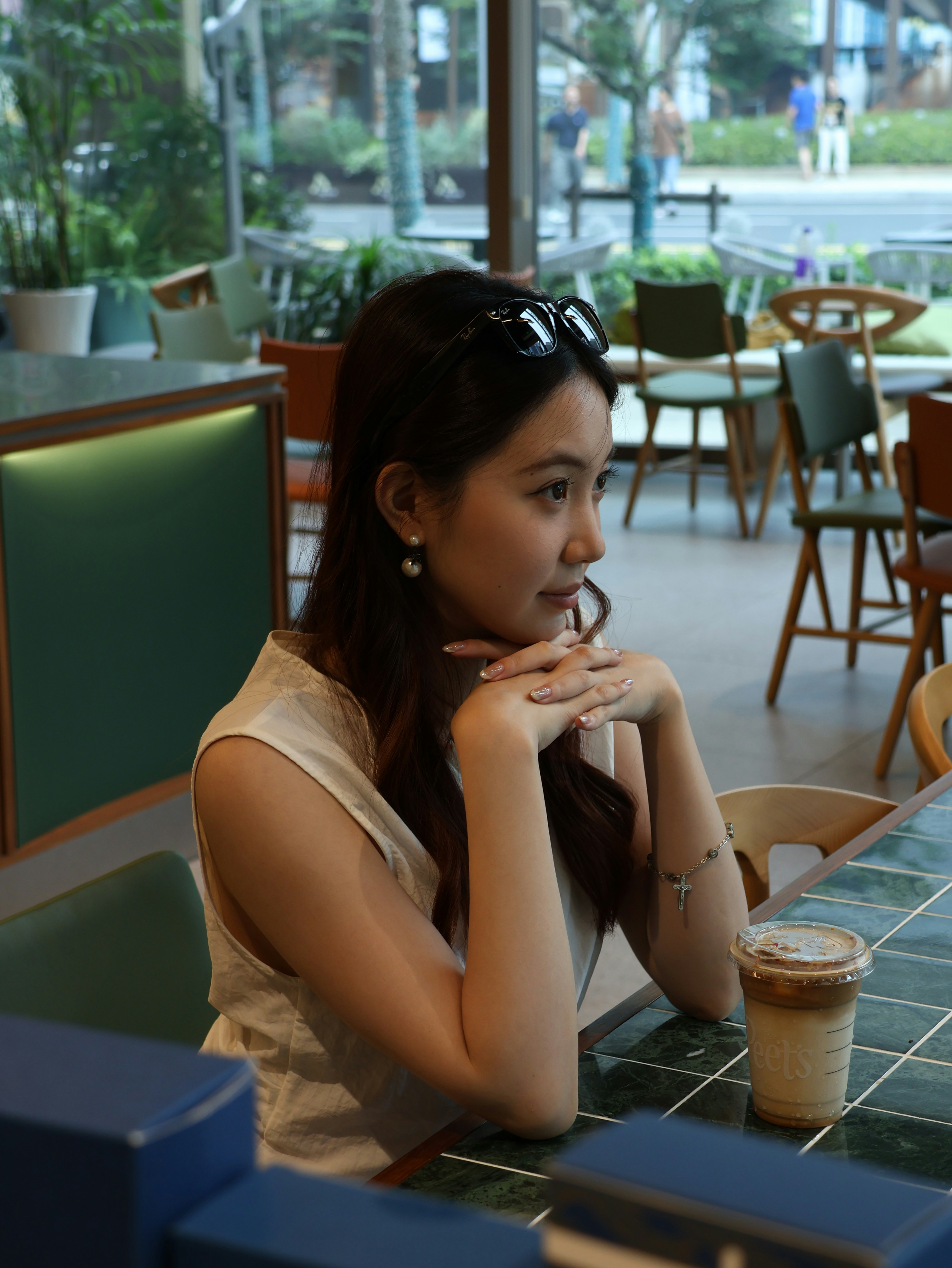 Cafe Reflections: A Quiet Moment with a Contemplative Smile