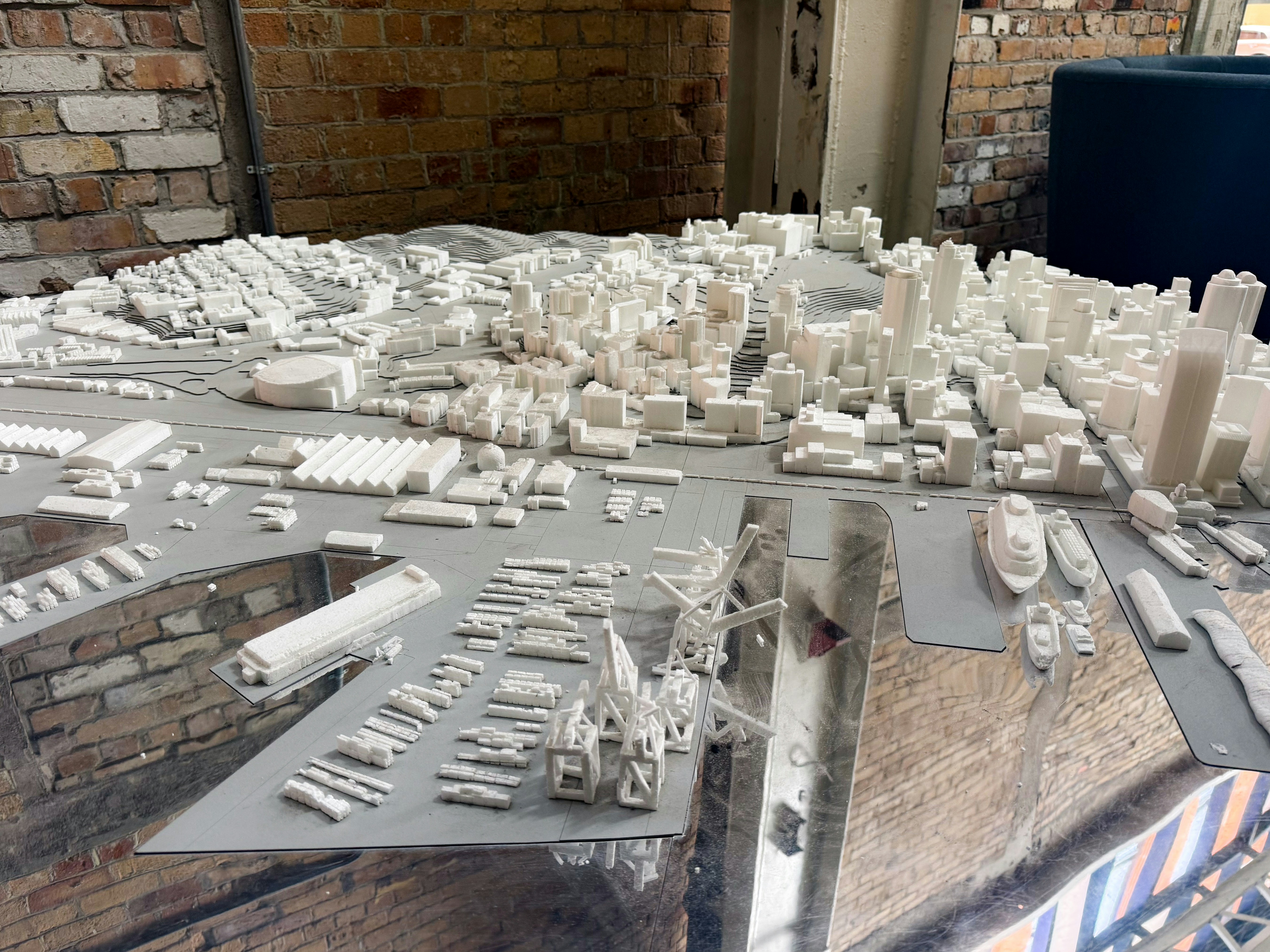Architectural Miniatures on a Tilted White Table