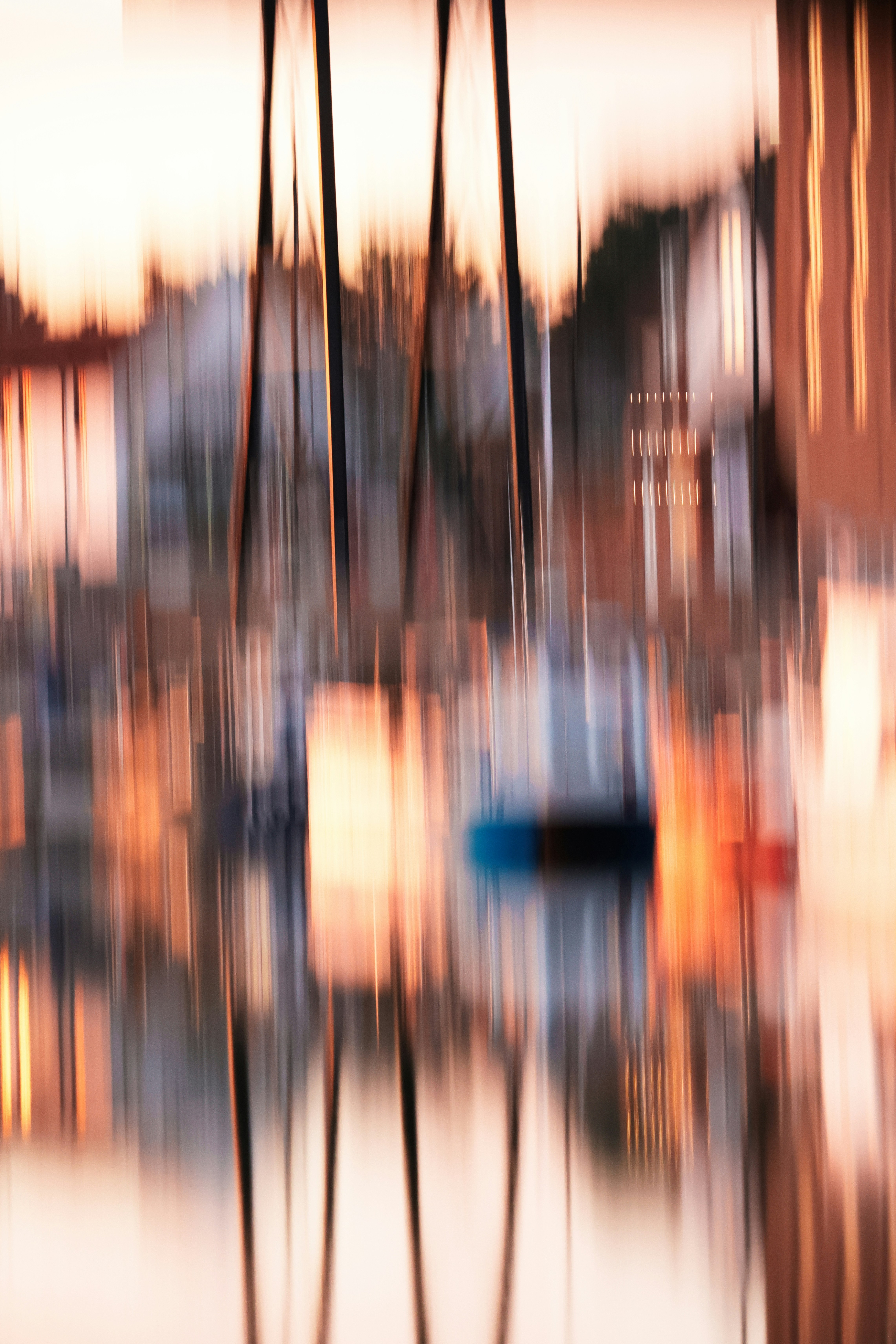 Blurred Marina Reflections: Vertical Threads of Sunset