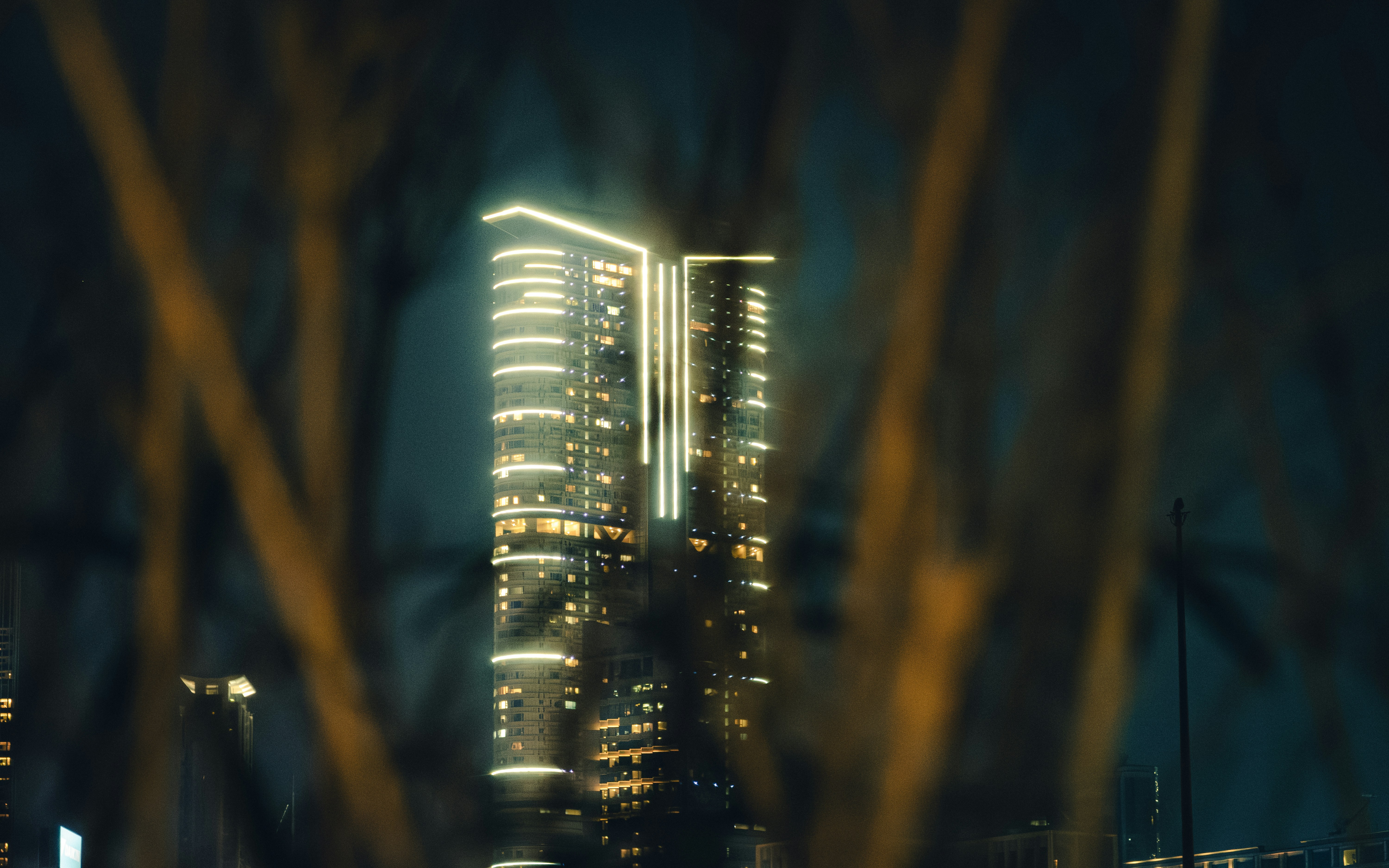 Luminous Twin Skyscrapers Piercing the Night