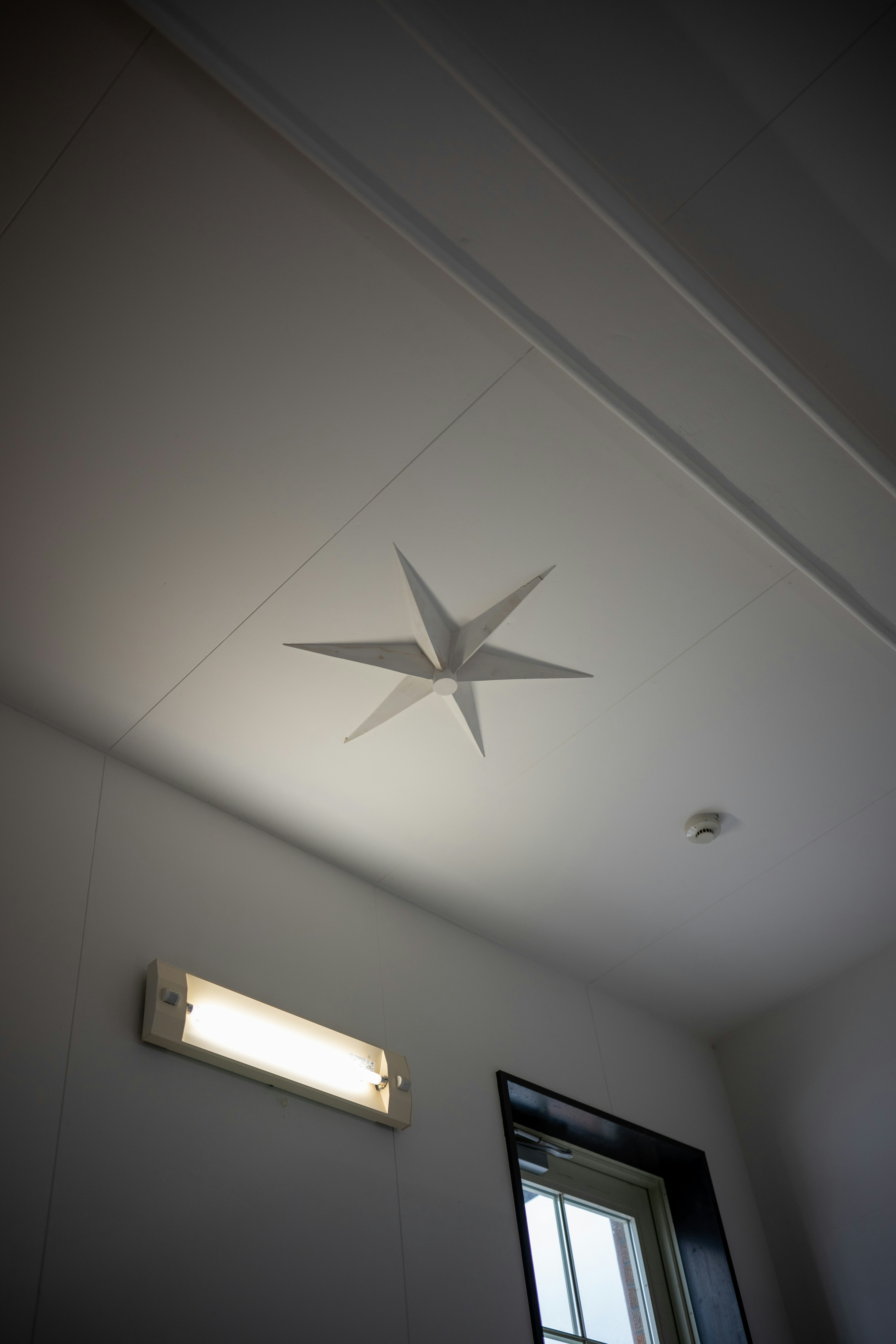 Floating Starburst in a Minimal Ceiling Scene