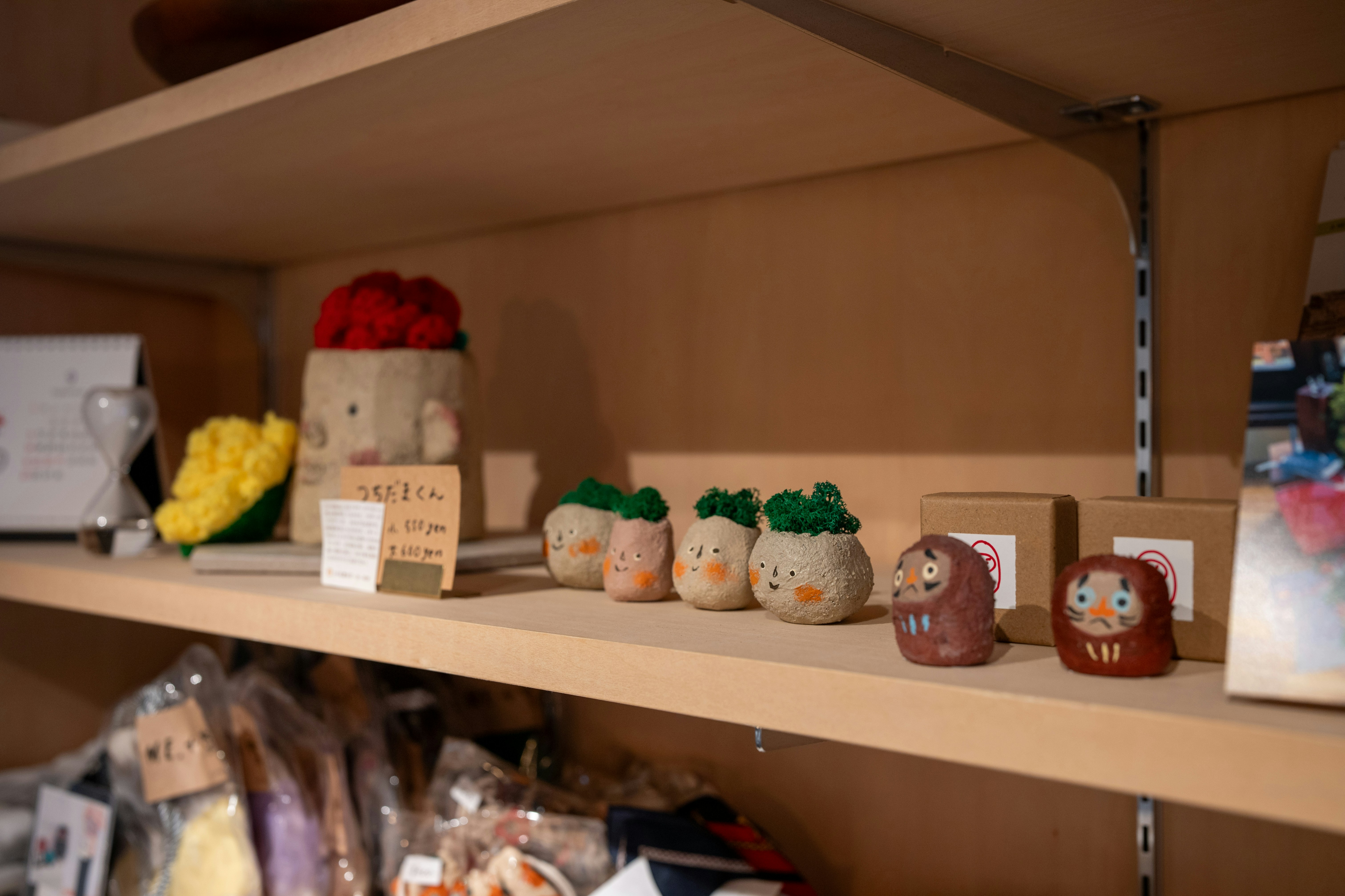 Tiny Ceramic Figures on a Wood Shelf