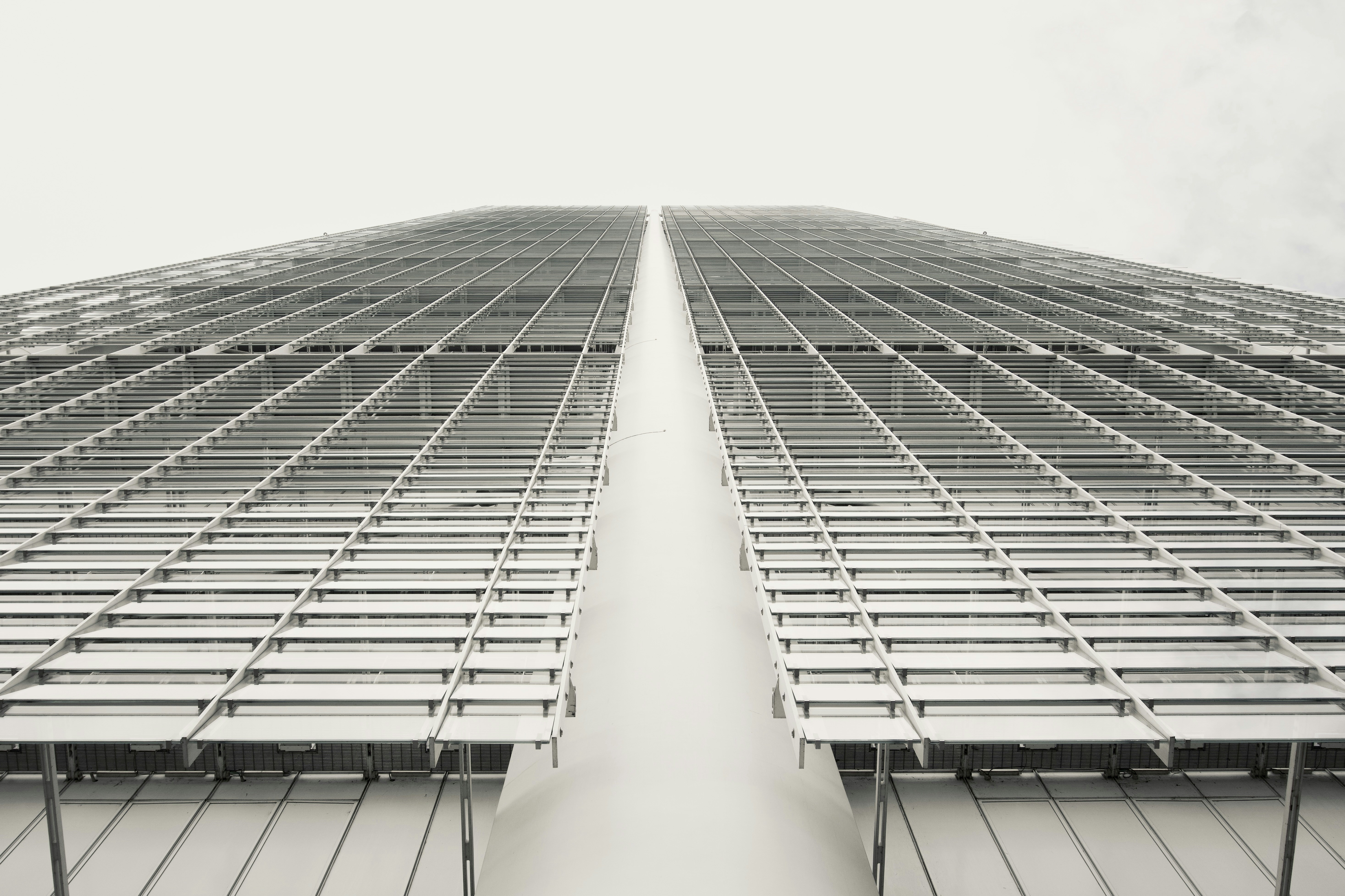 Symmetric ascent: a converging facade rises toward the sky