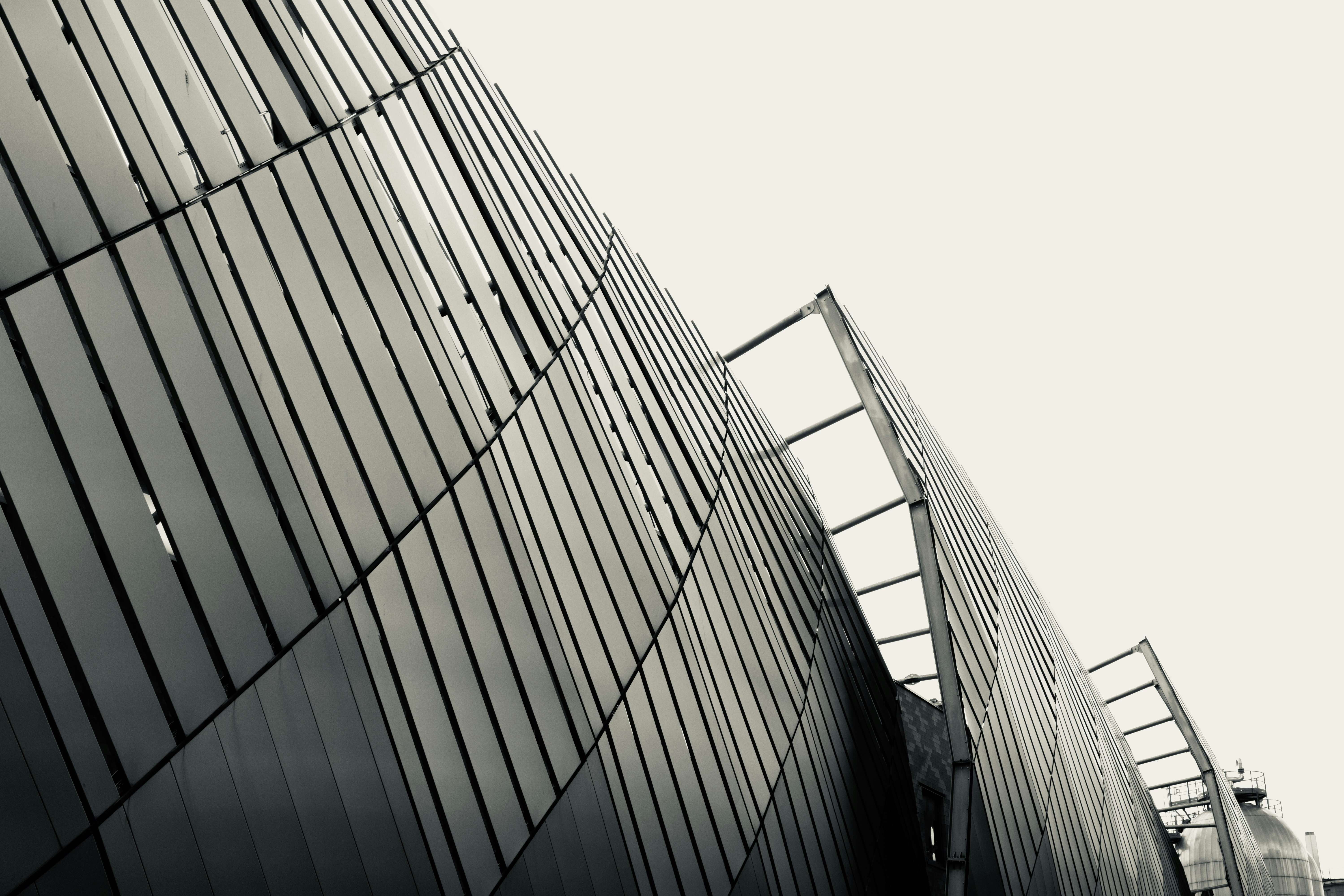 Curved Glass Facade: An Abstract Symphony of Steel and Light