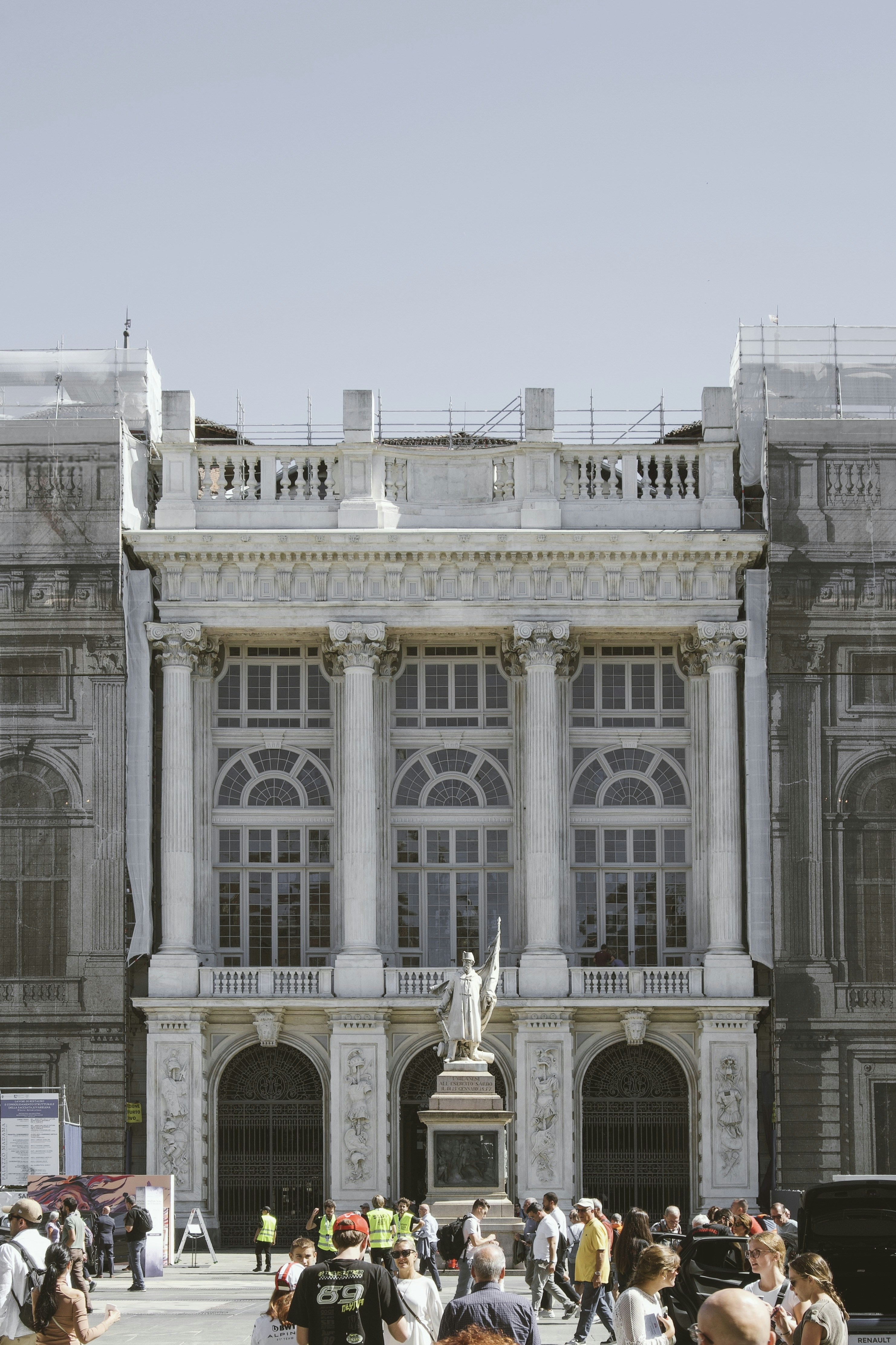 Symmetrical Facade and Statue: A Grand Square in Focus