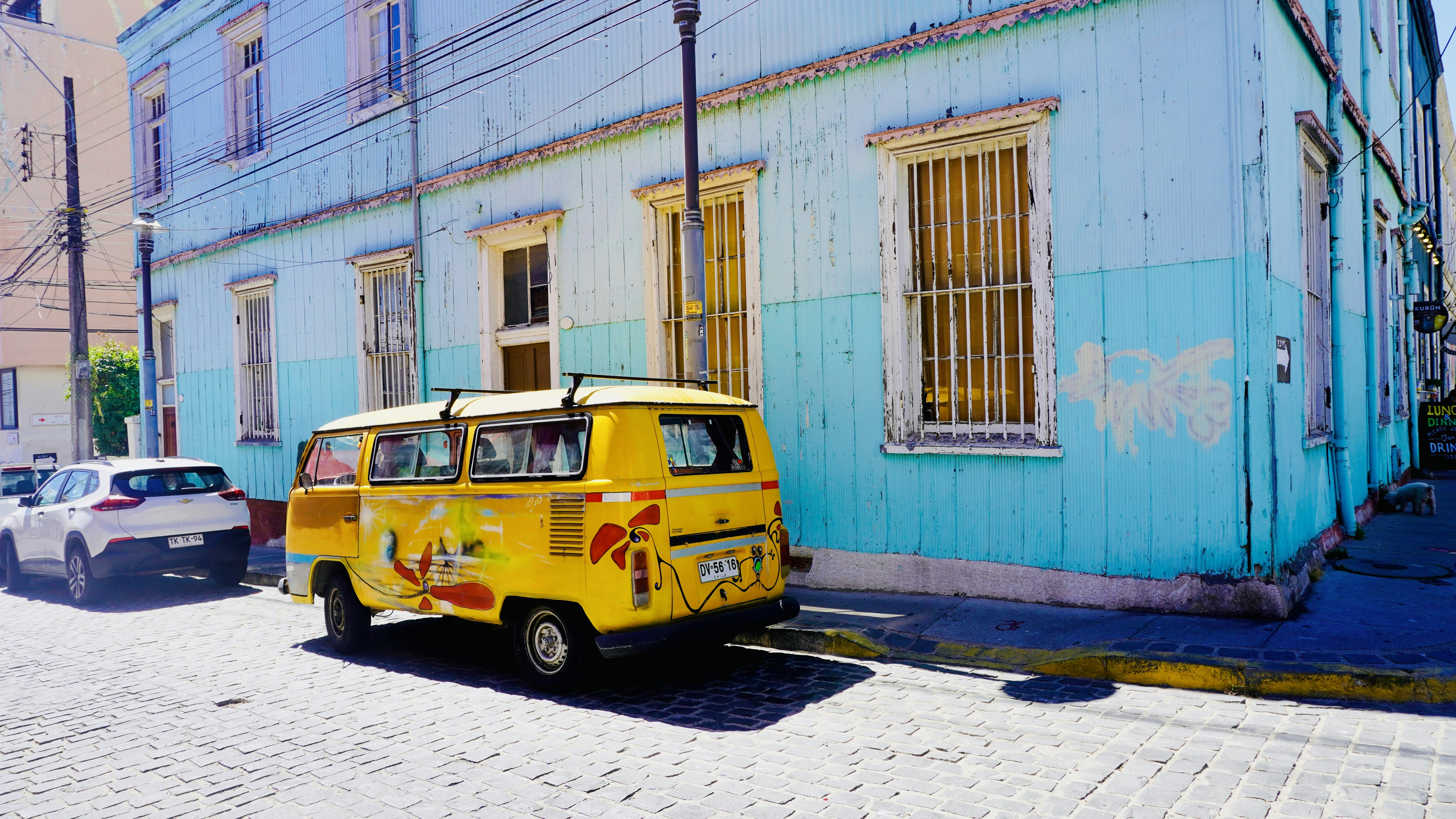 Yellow VW Van in a Turquoise Street Scene