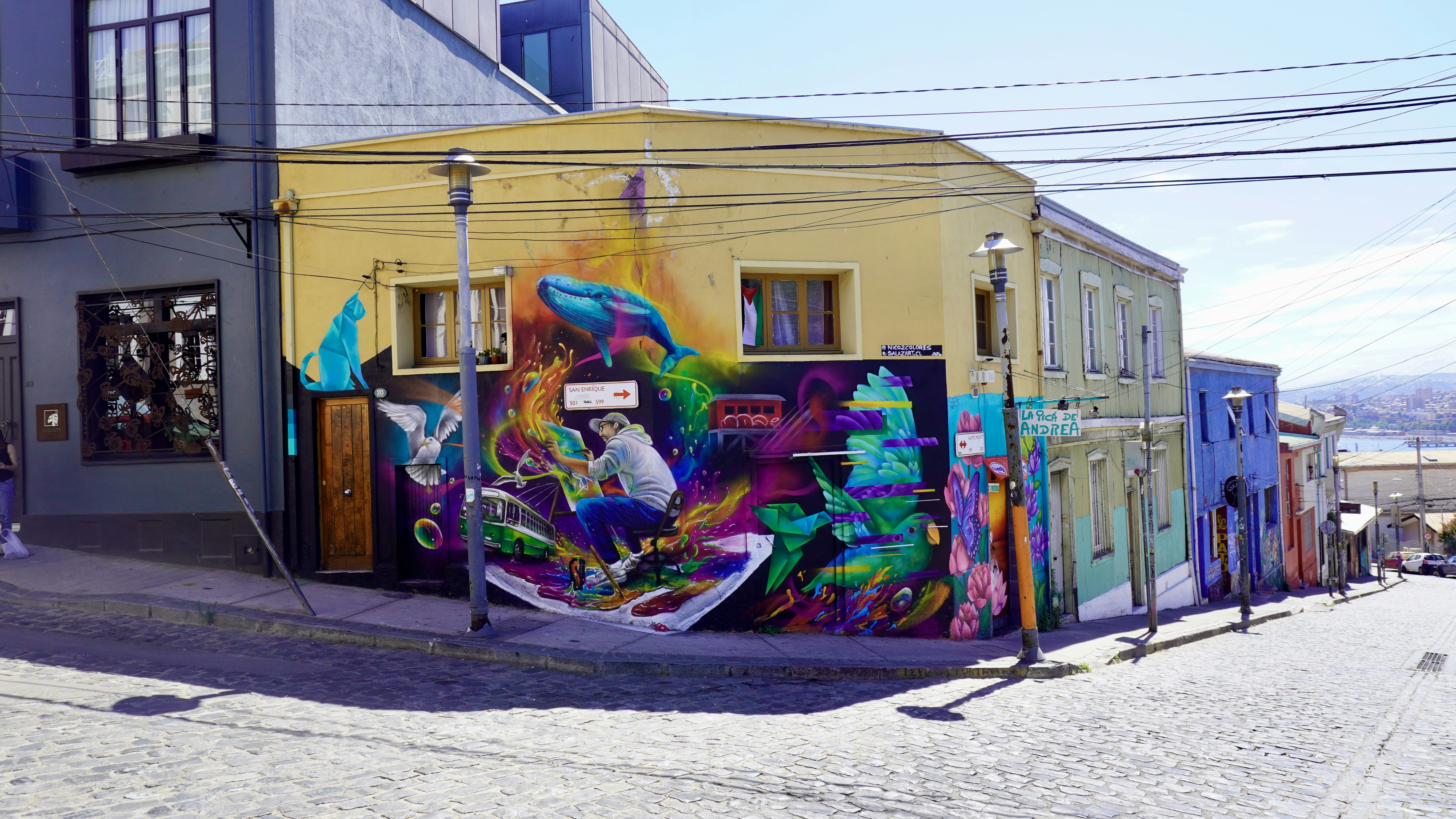 Vibrant Street Murals: A Sunlit Alley of Color