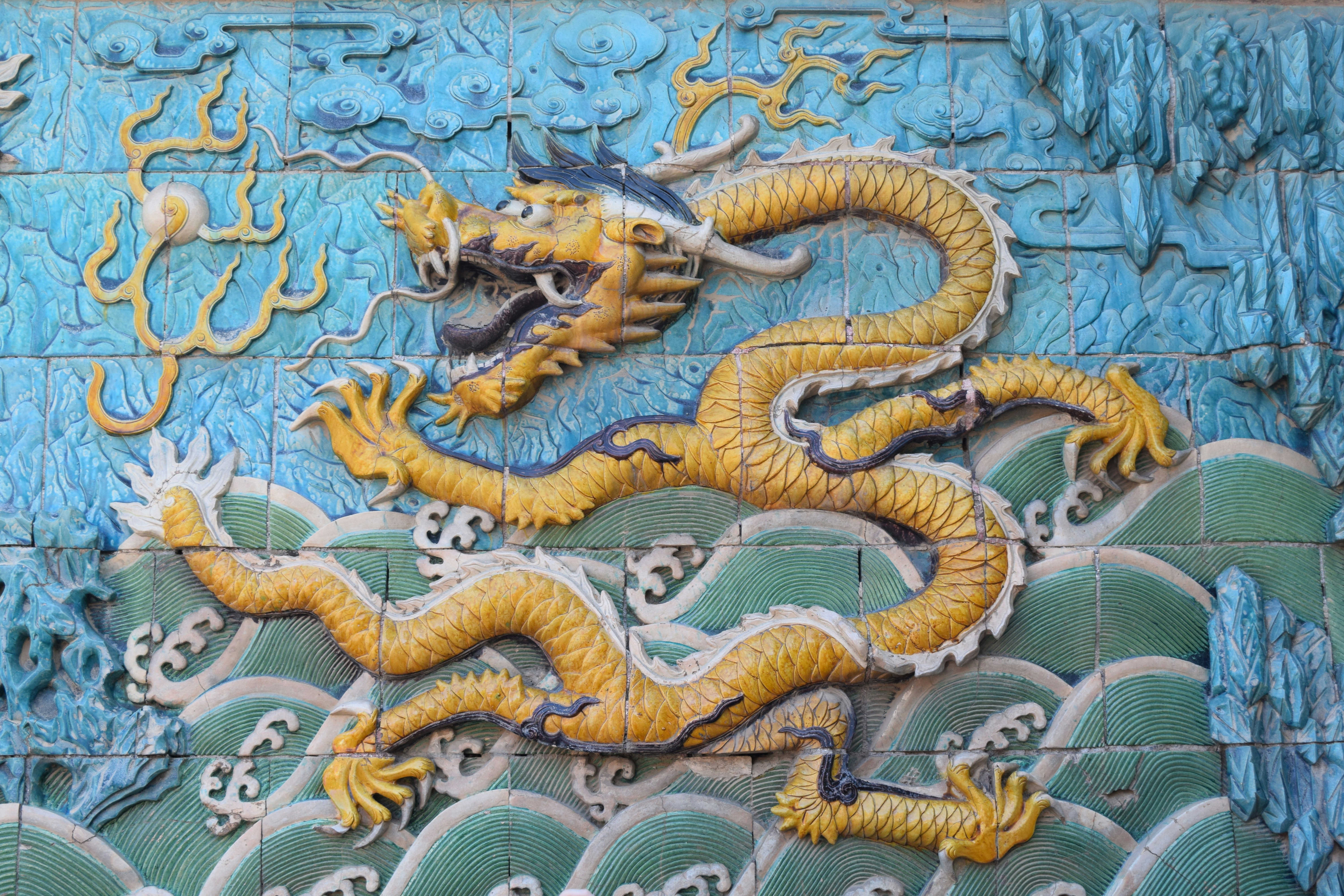Dragon in Blue Waves: A Sculpted Mural of Fire and Flood