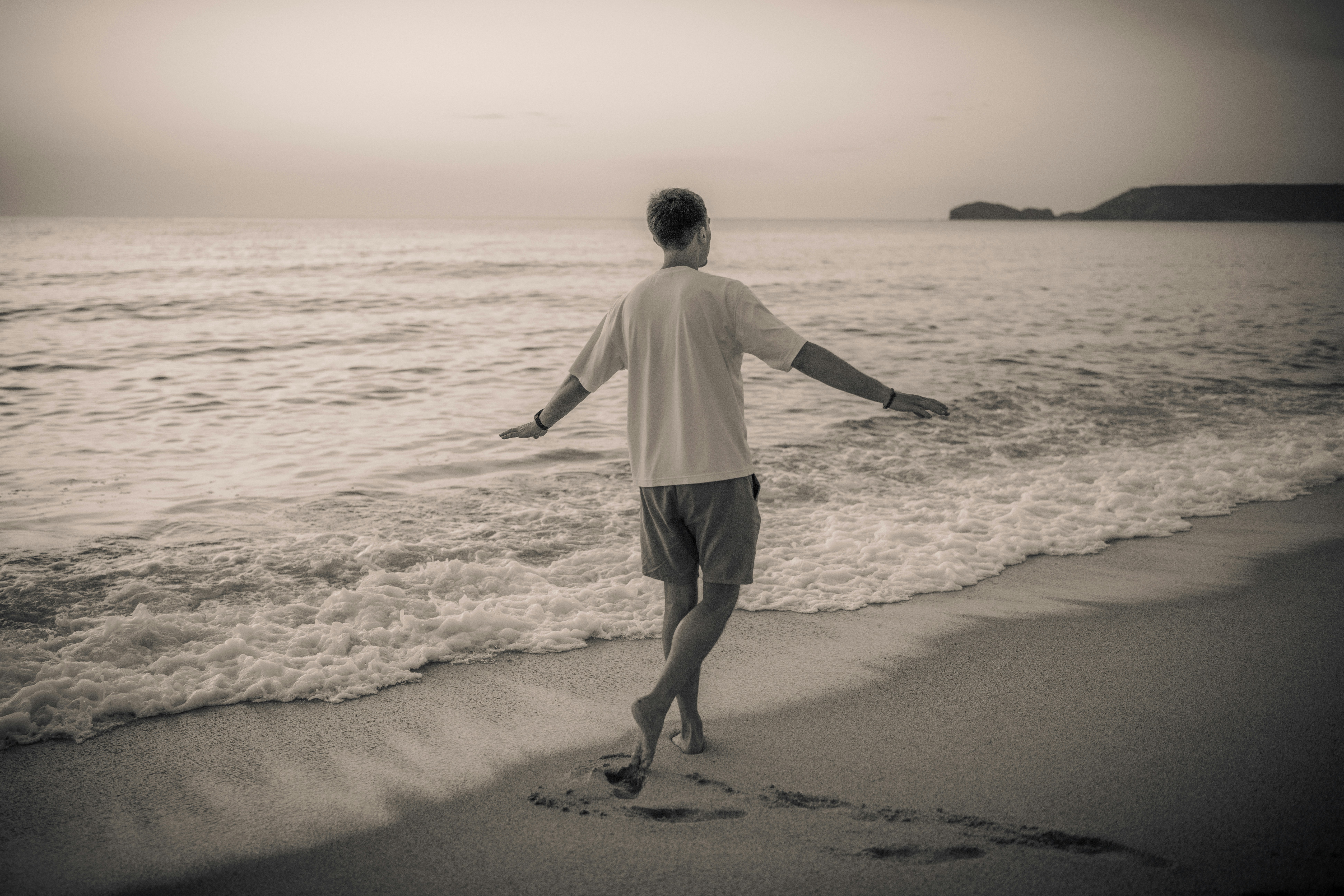 Mid-Stride Balance: A Quiet Beach Moment