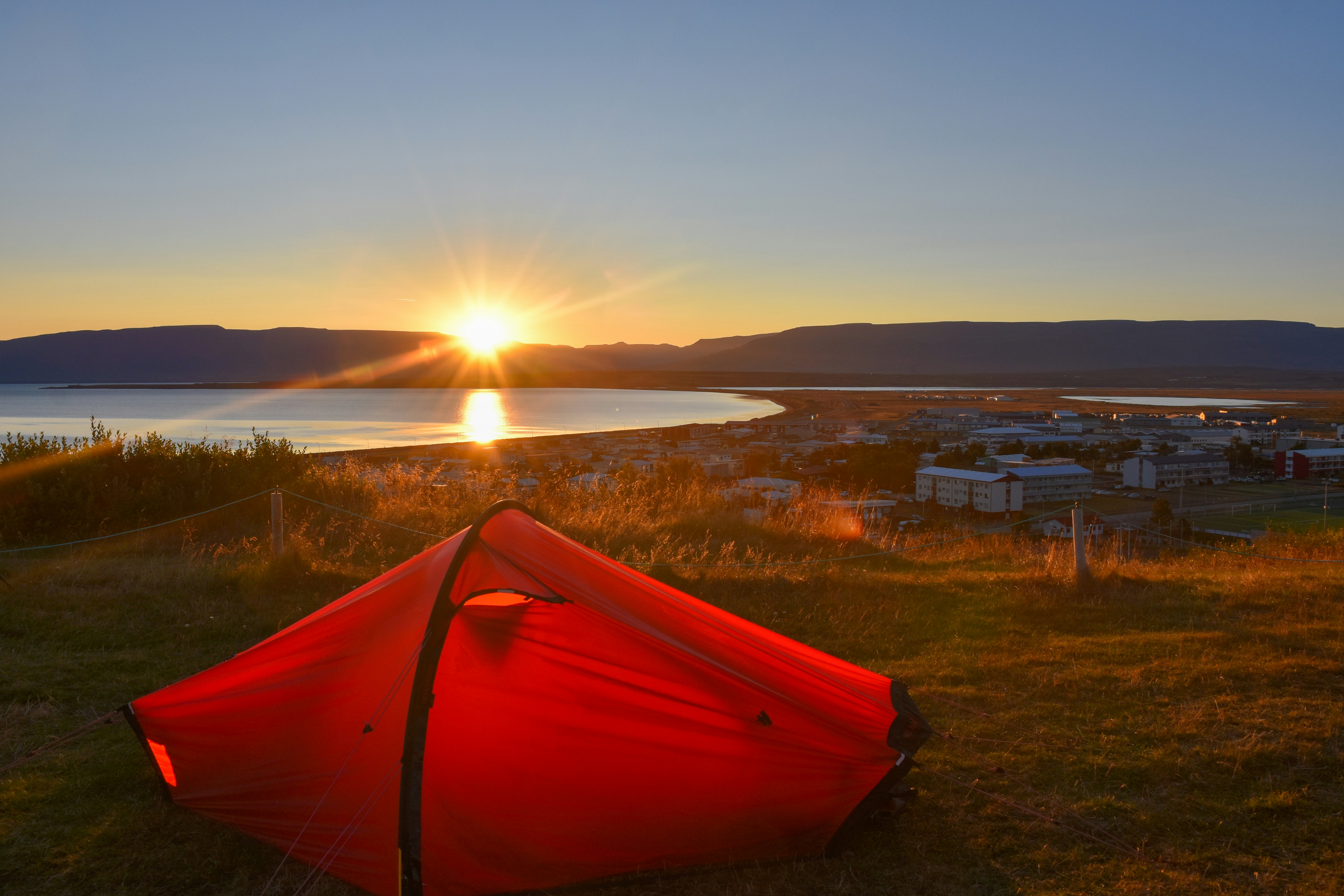 Red Tent at Golden Bend: Twilight Camp by the Fjord