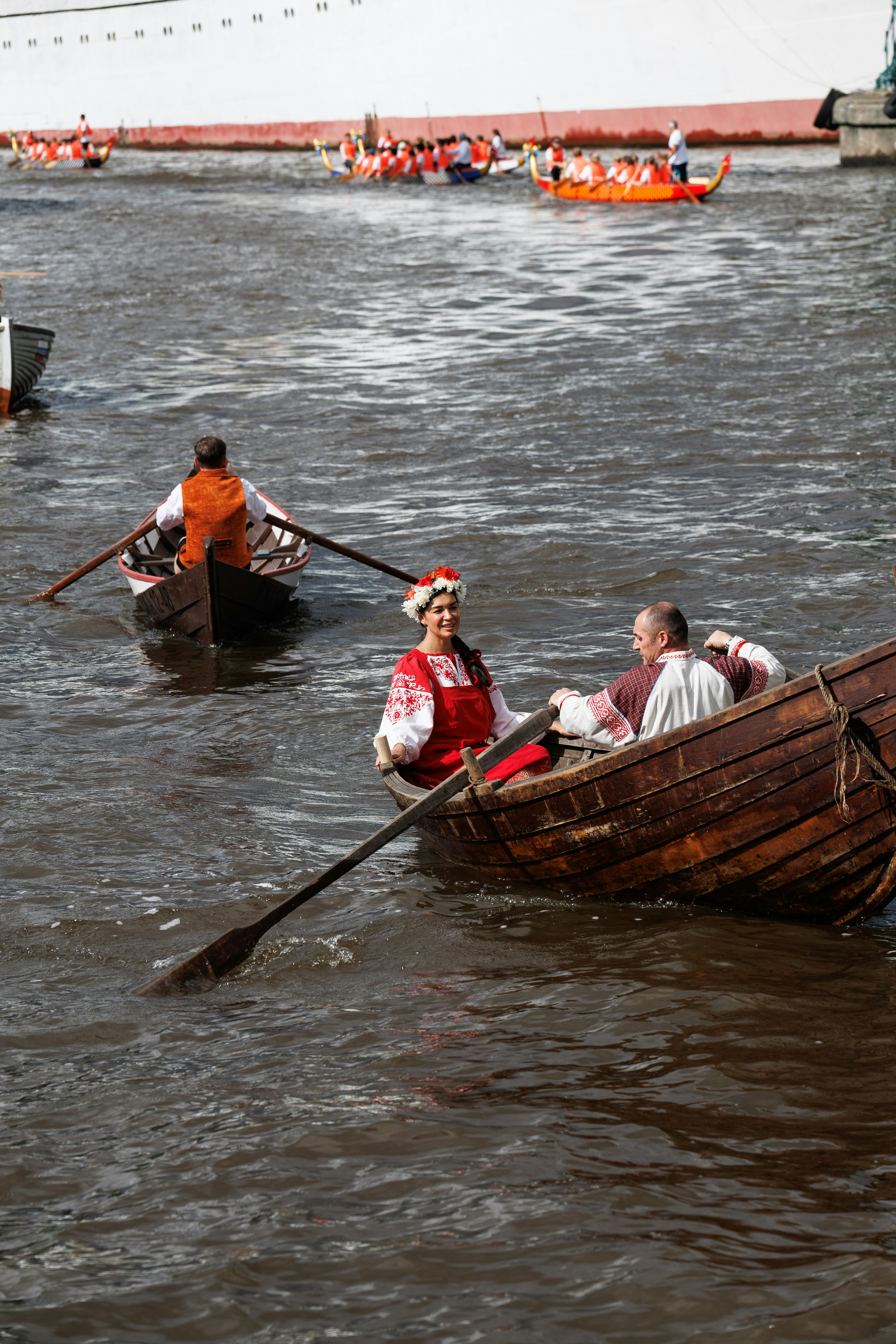 Colors of First Light: Celebrants in Wooden Boats