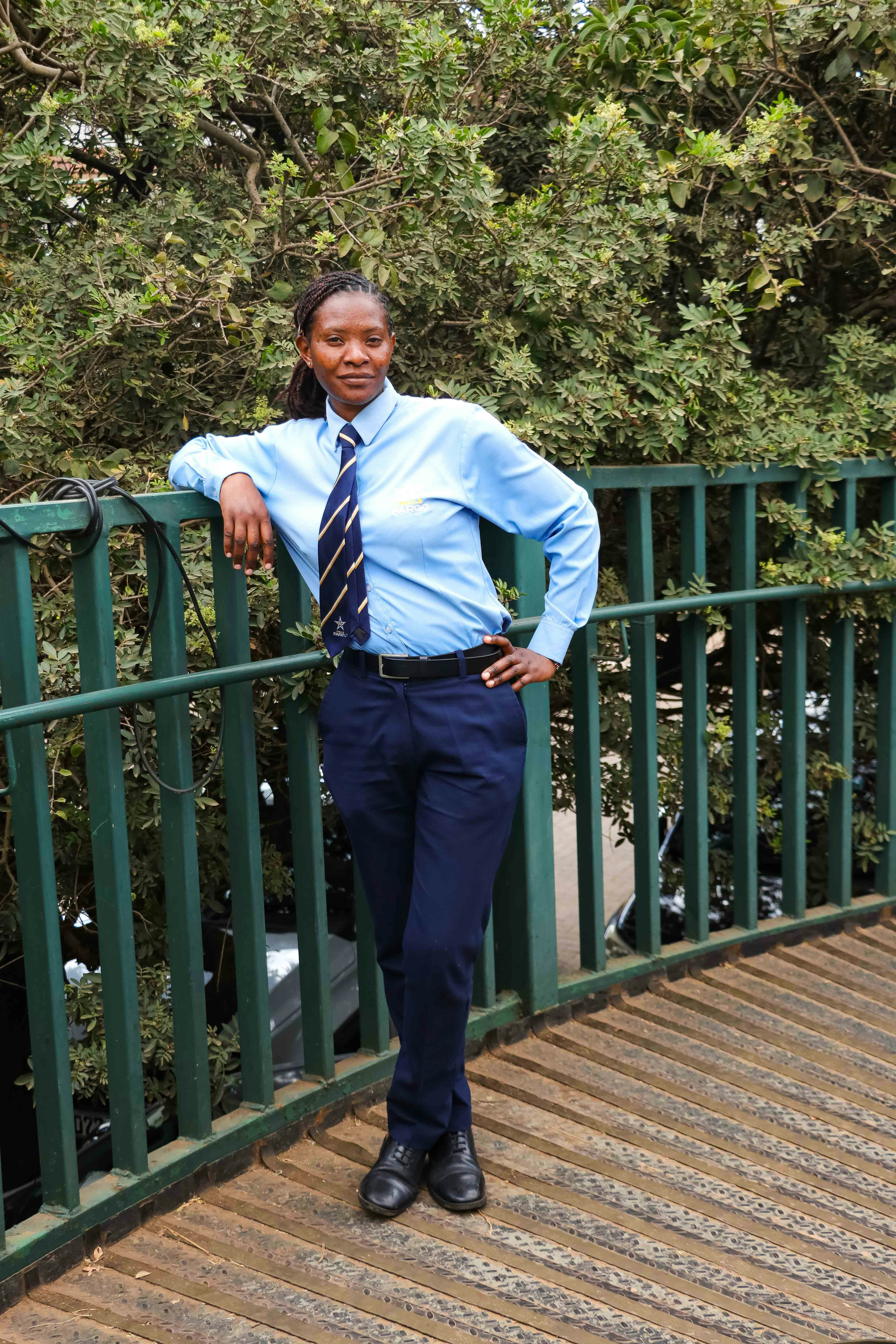 Uniformed Poise on the Riverside Walk