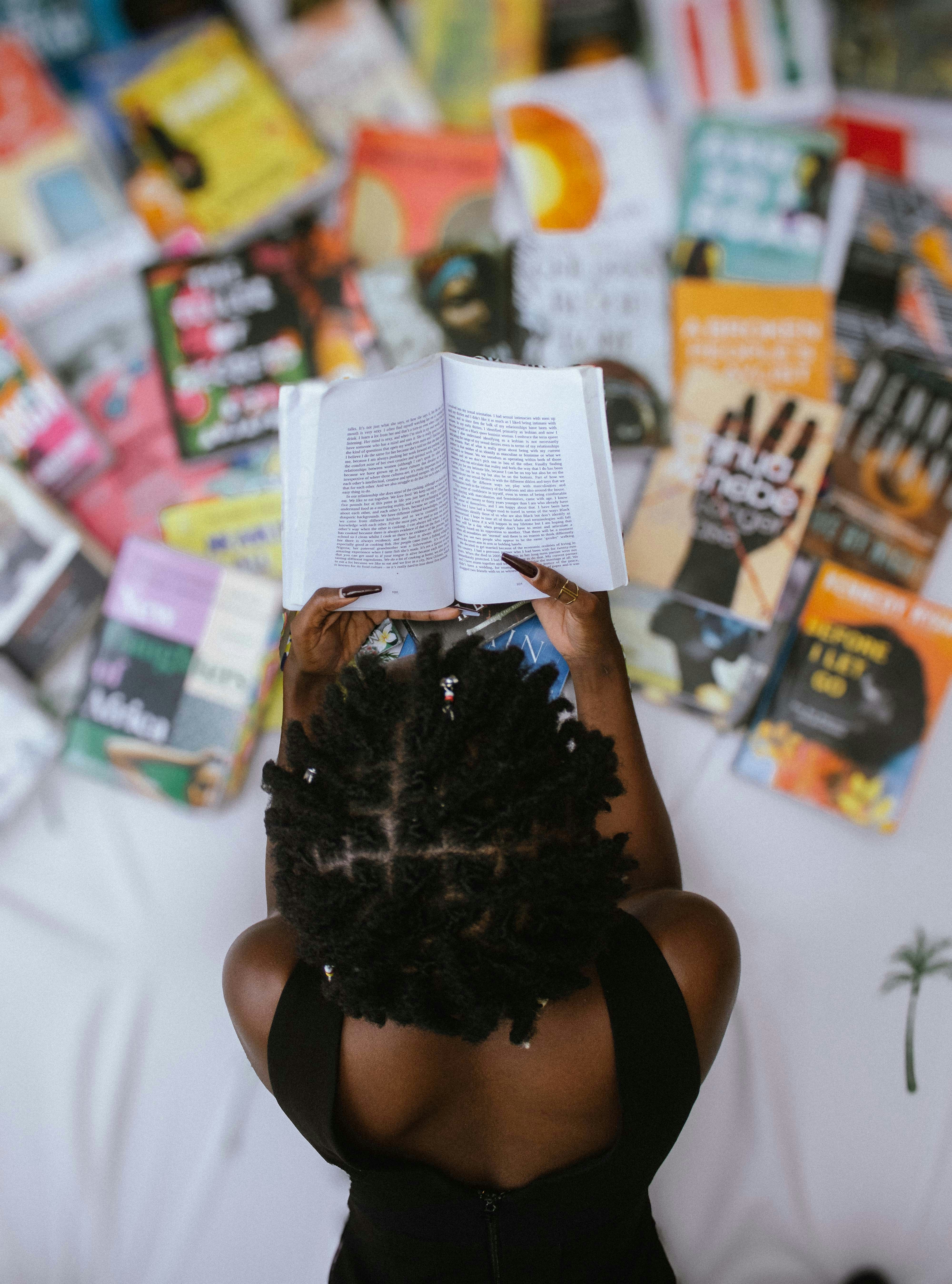 Open-book Reverie: A Dancer’s Silhouette Beneath a Wall of Words