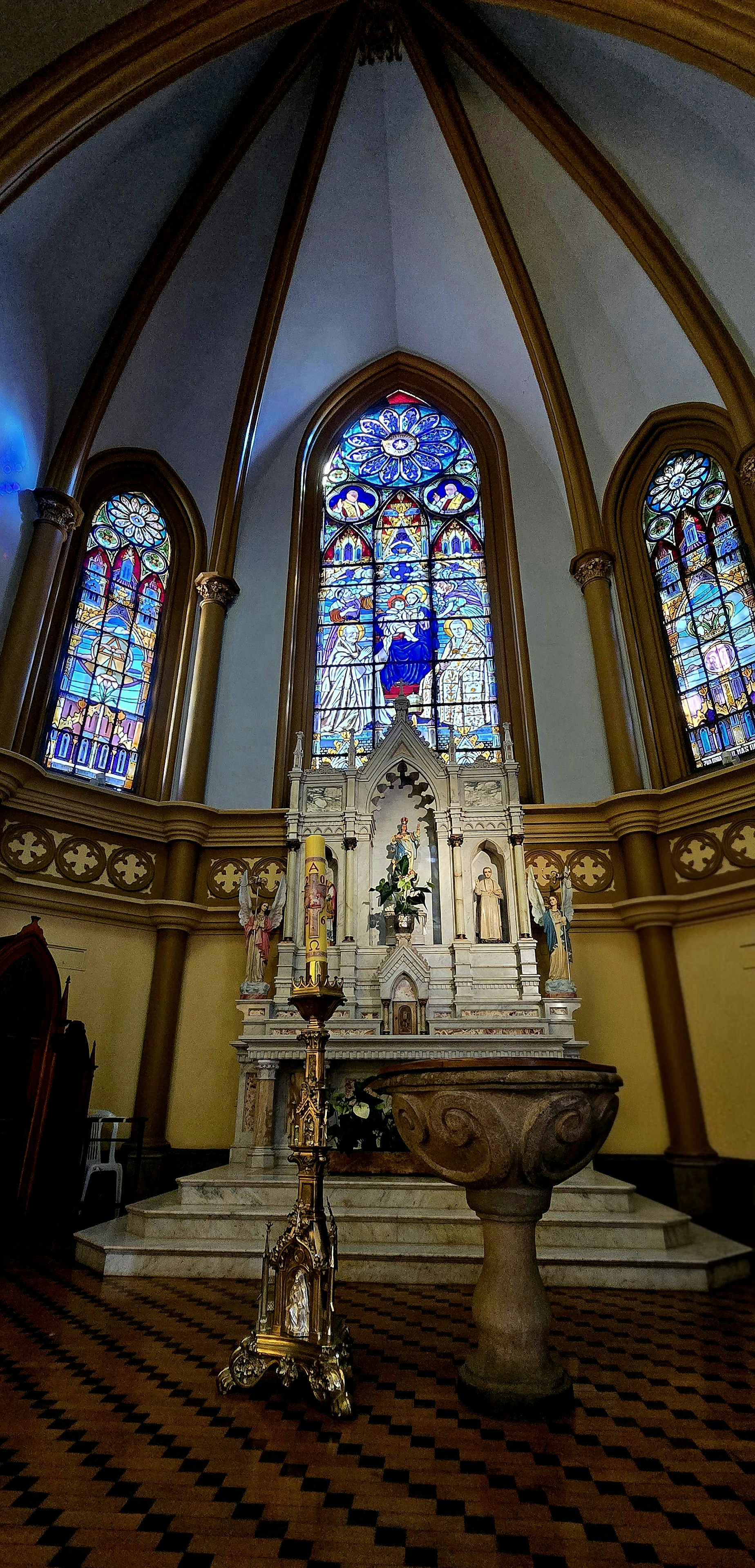 Gothic Interior Altar: Stained Glass Light on an Ornate Shrine