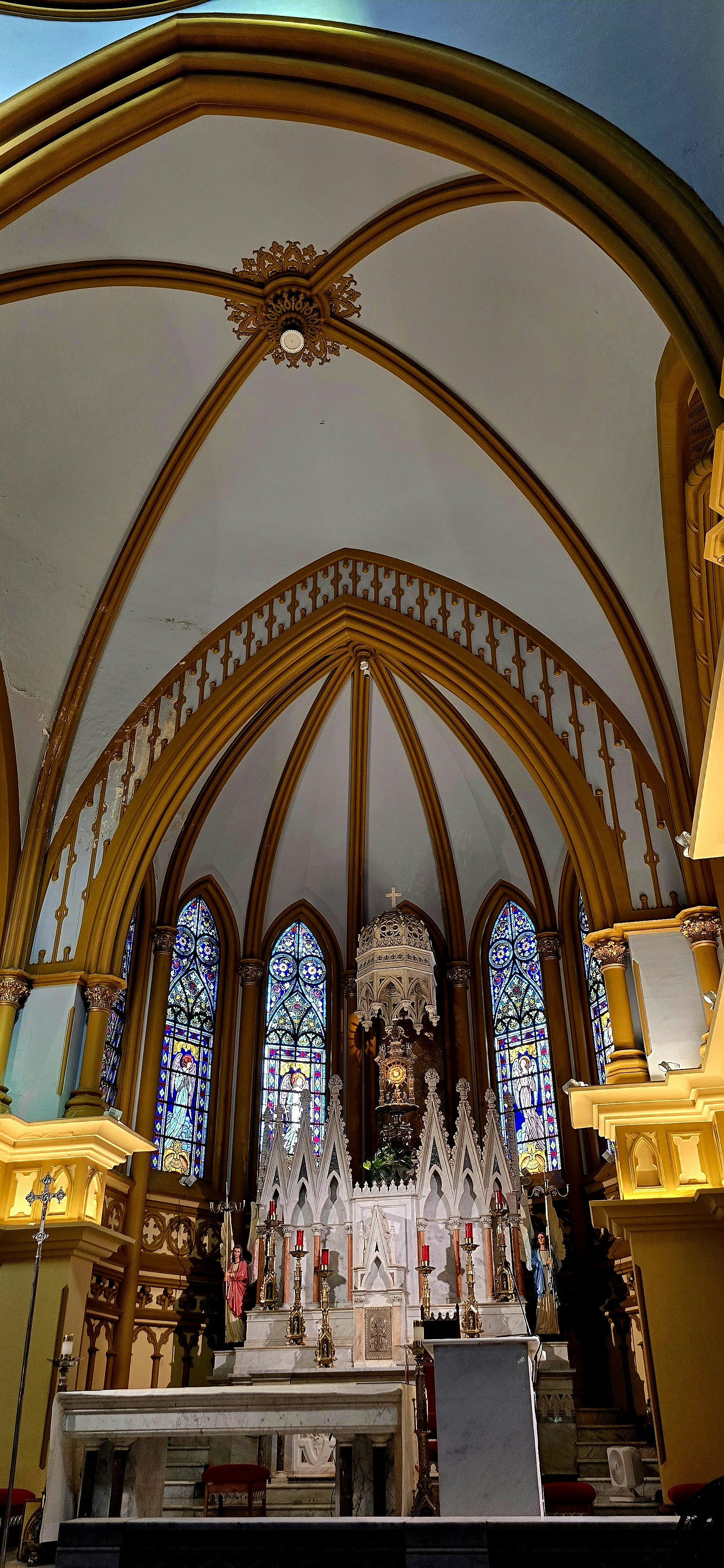 Gothic Sanctuary: Light through Stained Glass Above the Altar