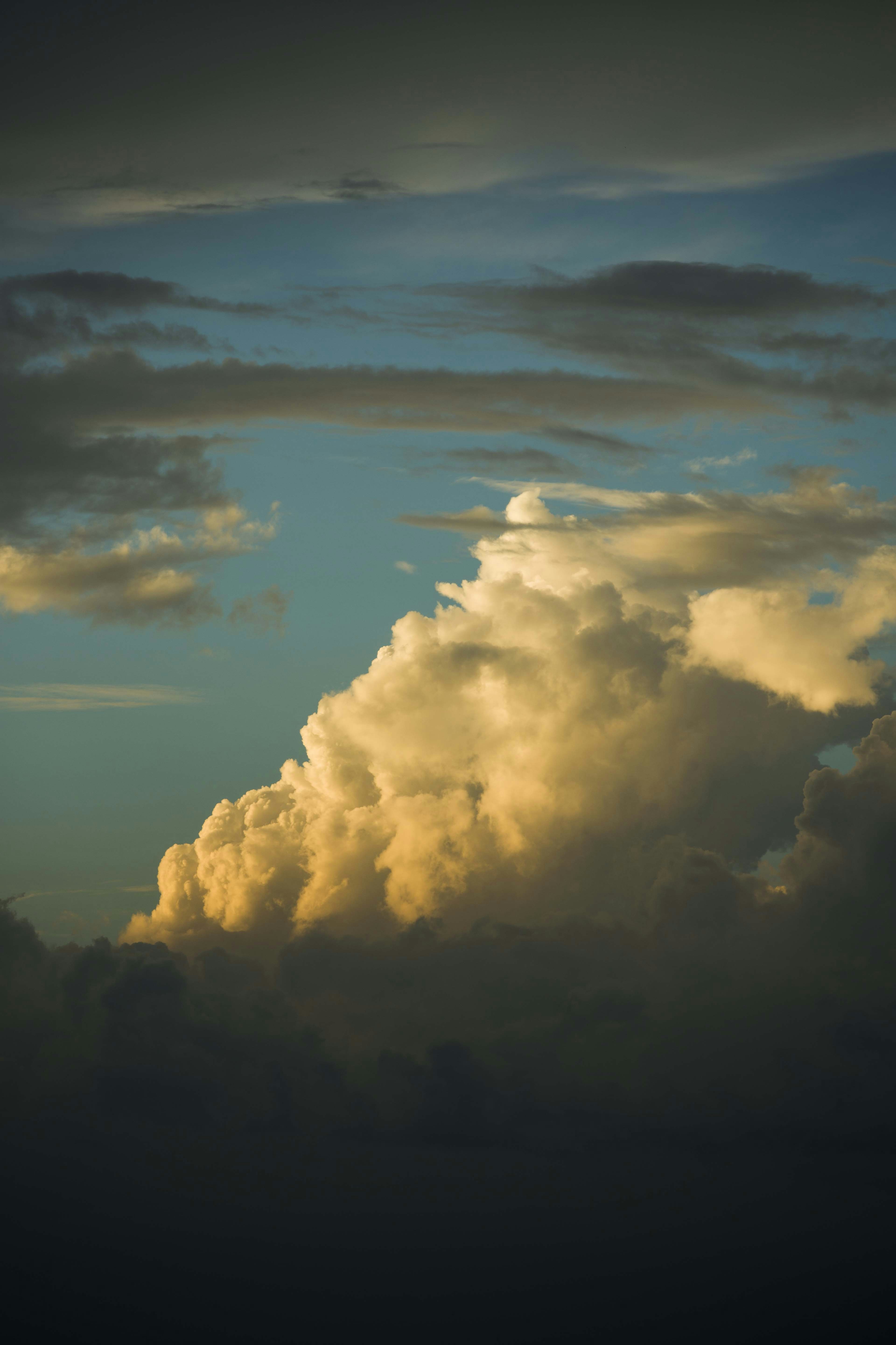 Cloud Cathedral: Giant Formation Piercing a Golden Sky