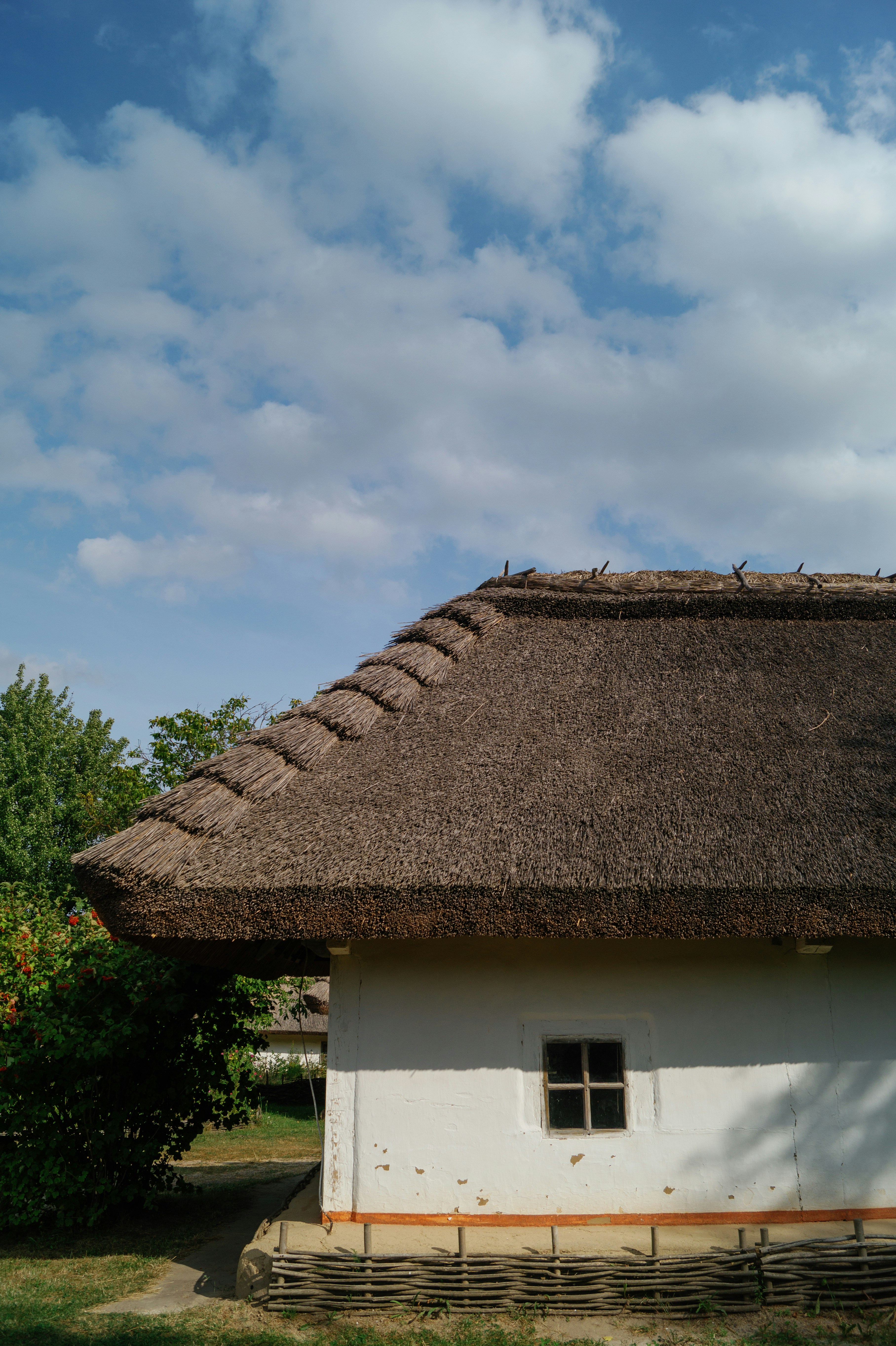 Thatched Roof Quiet: A Cottage Under a Sky of Soft Light