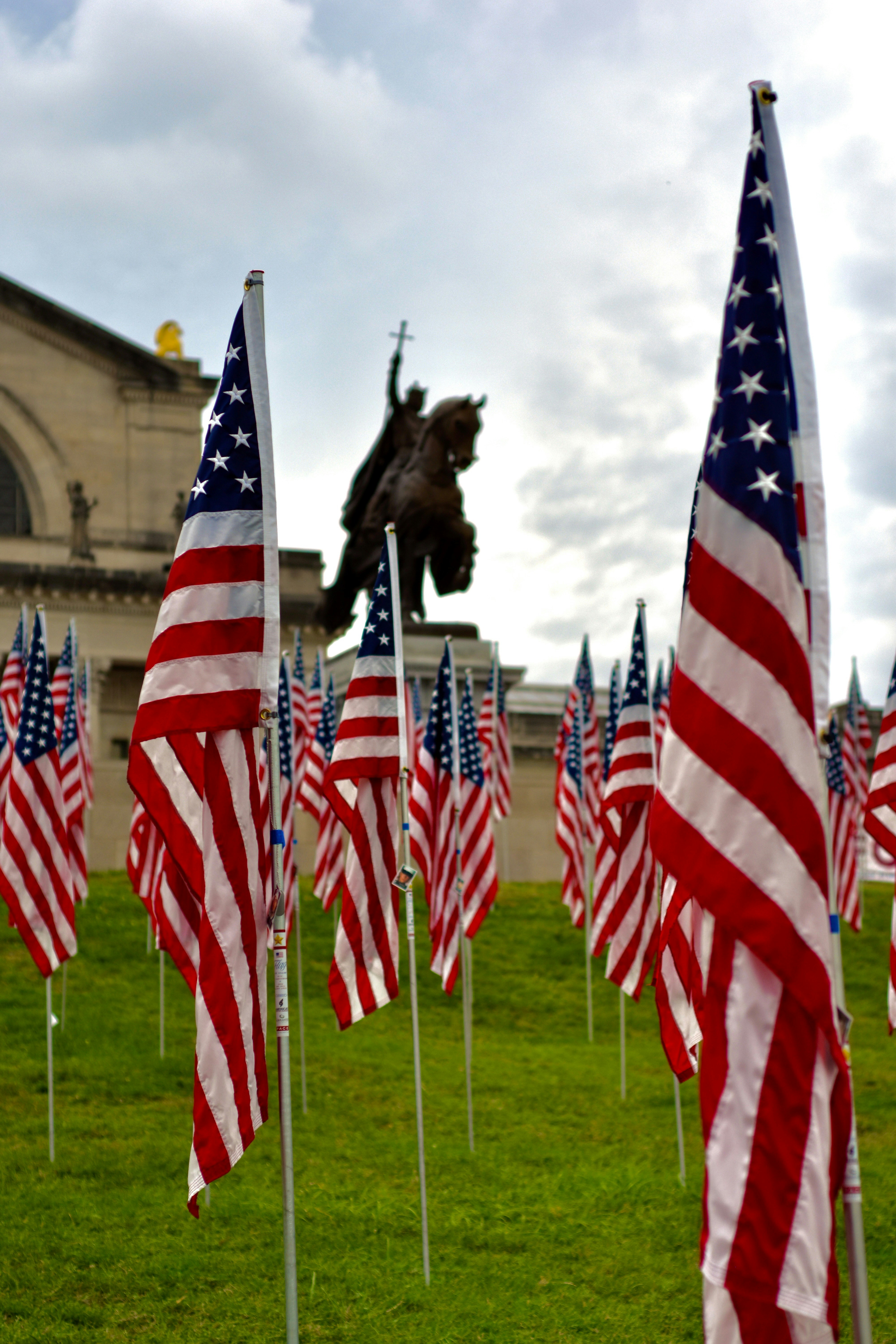 Fields of Honor: A Sea of Flags Before a Monumental Stature
