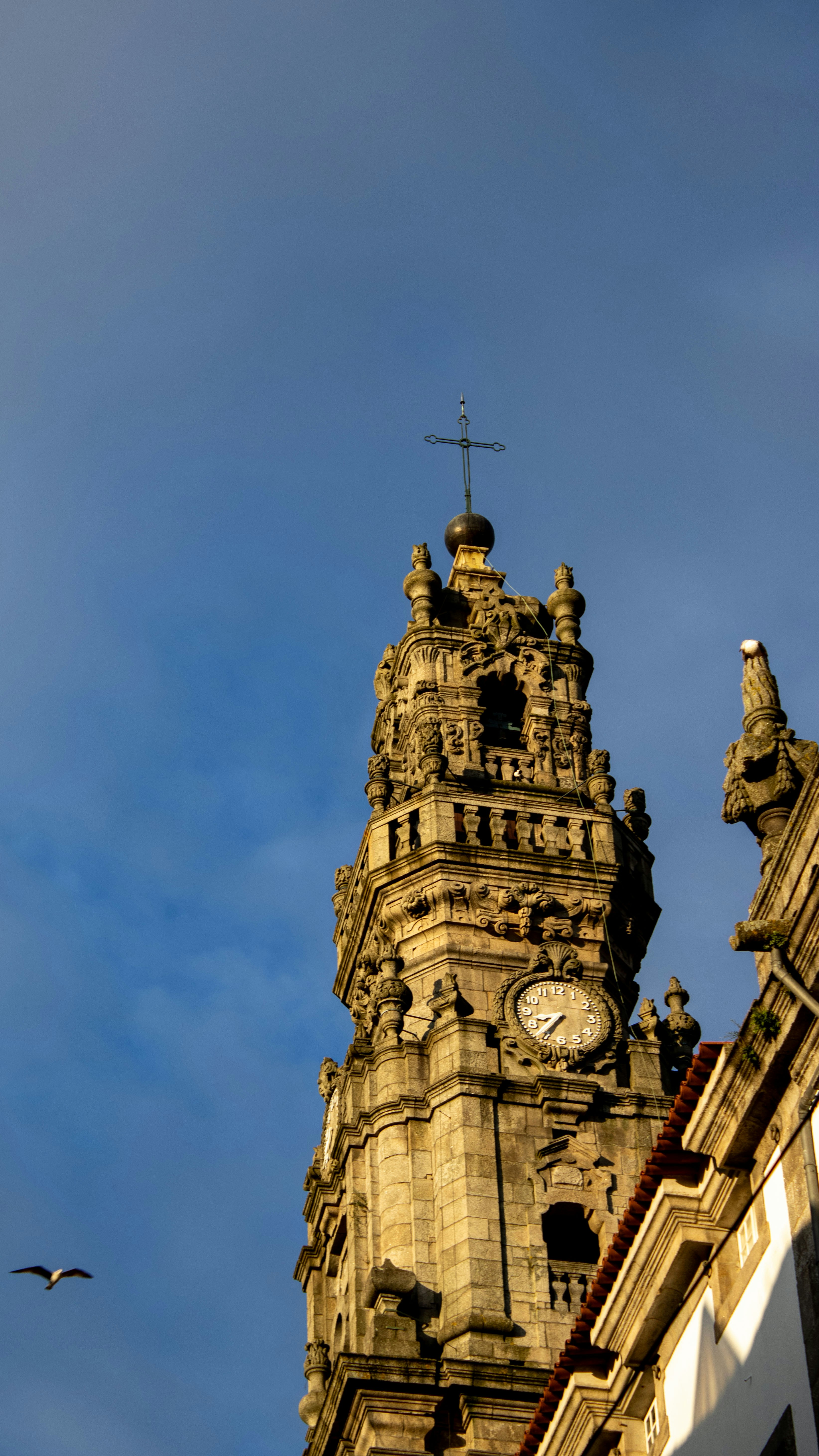 Clocktower Silhouette: Stone Ornament Against a Cerulean Sky