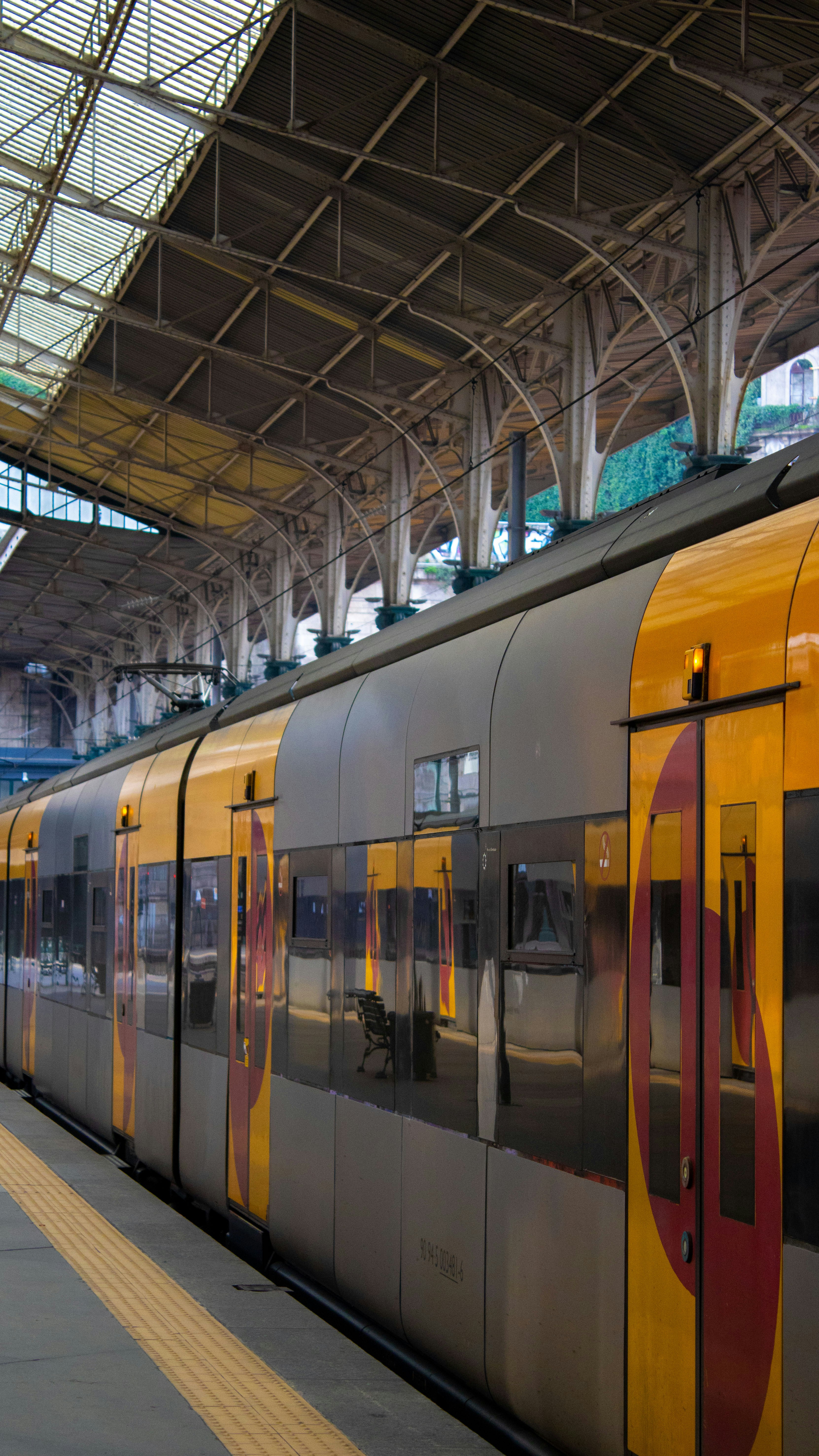 Railway Canvas: A Modern Train at Dusk in a Gridded Station