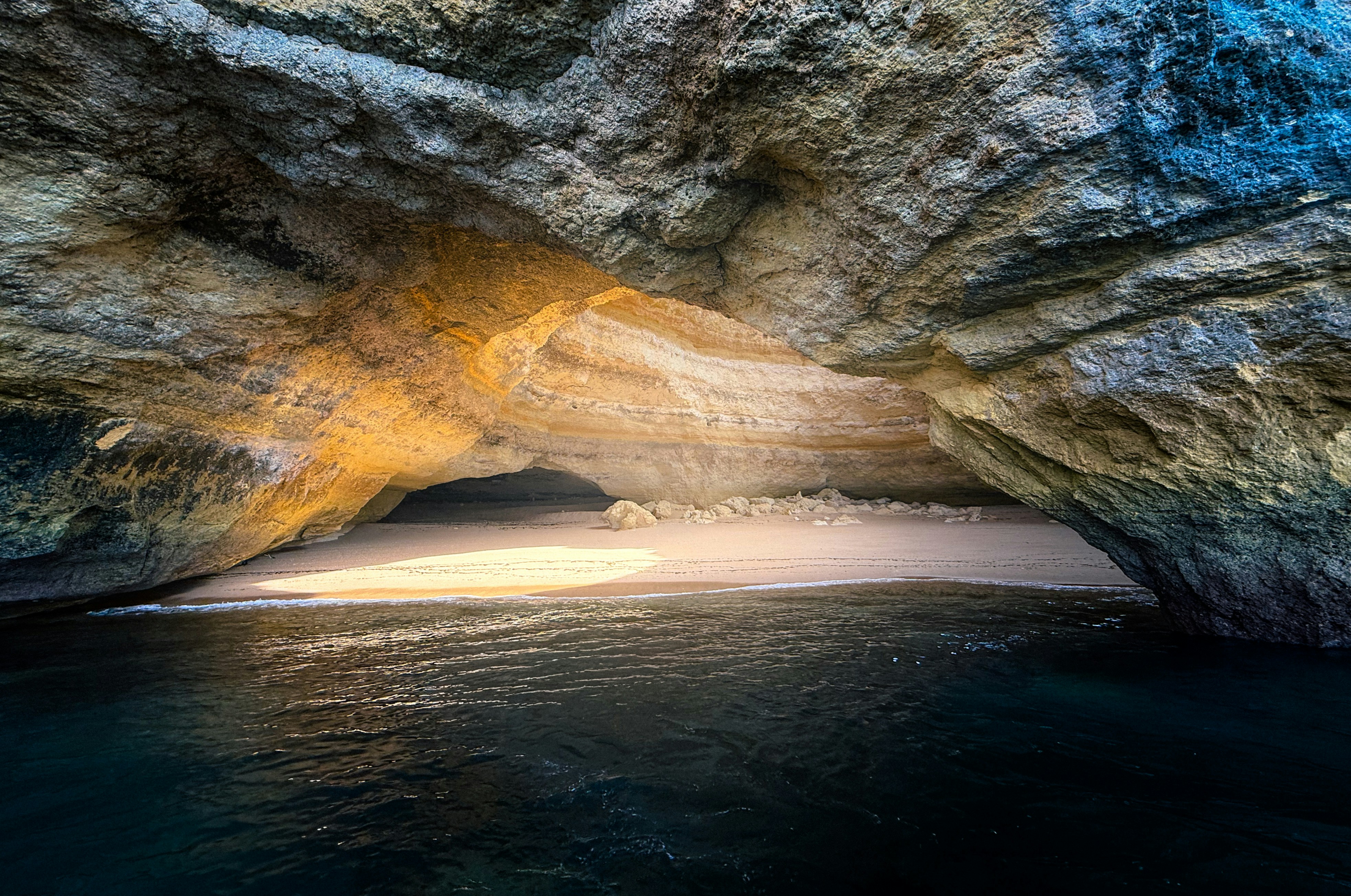 Sunlit Archway: A Cove Singing Through the Rock