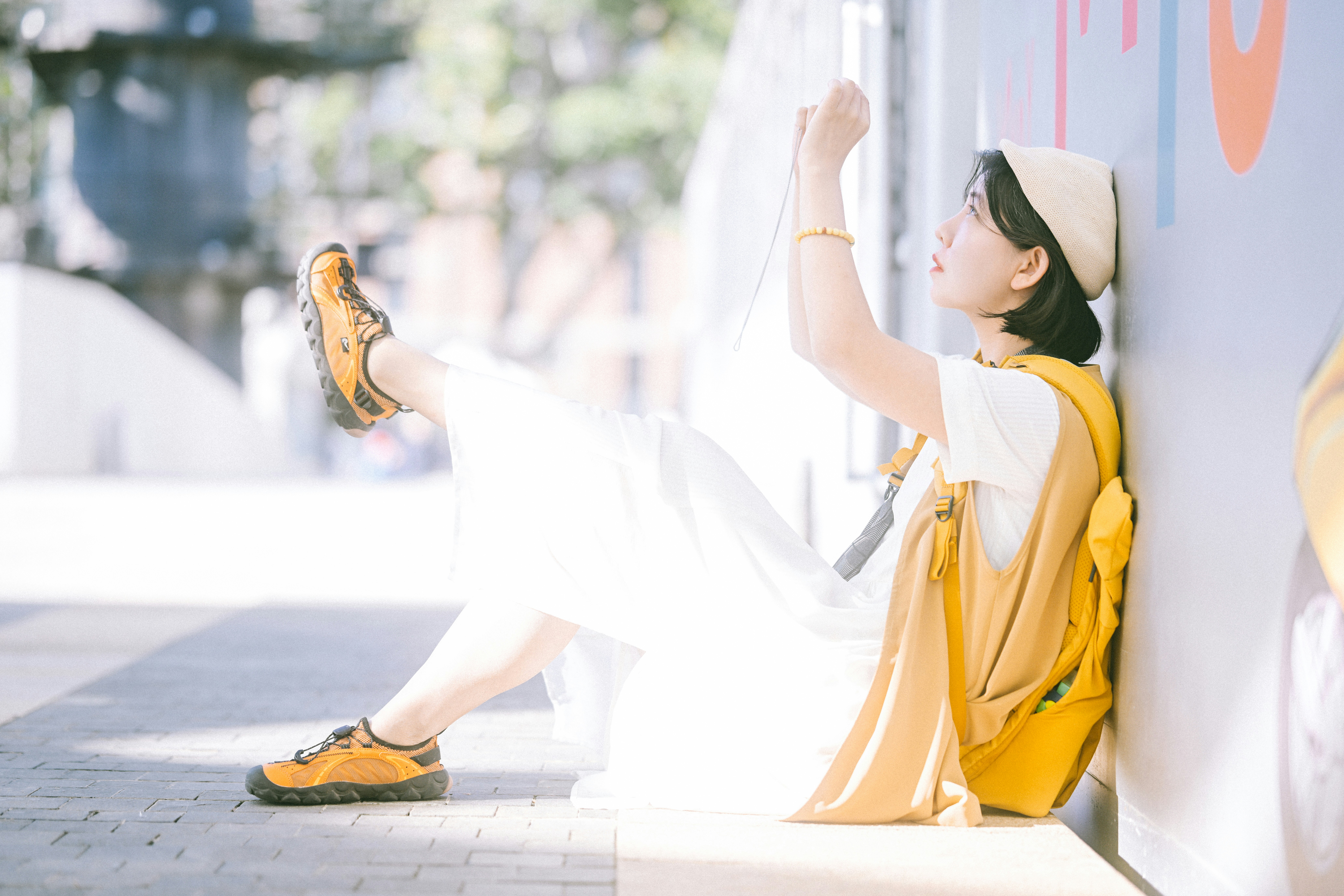 Sunlit Nomad: A Quiet Break on a City Wall