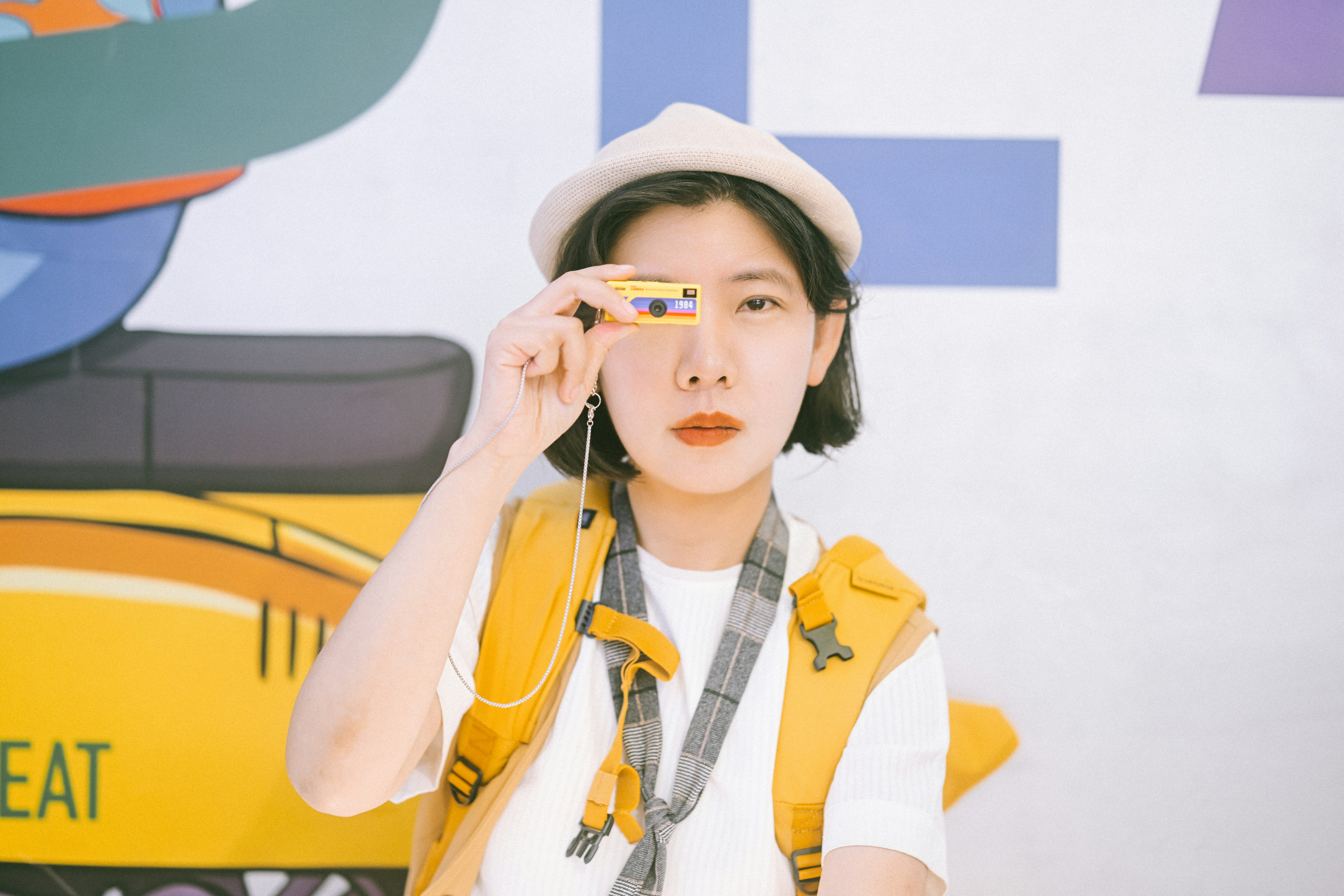 Portrait in Front of Colorful Wall: Eyewear Test with a Small Card
