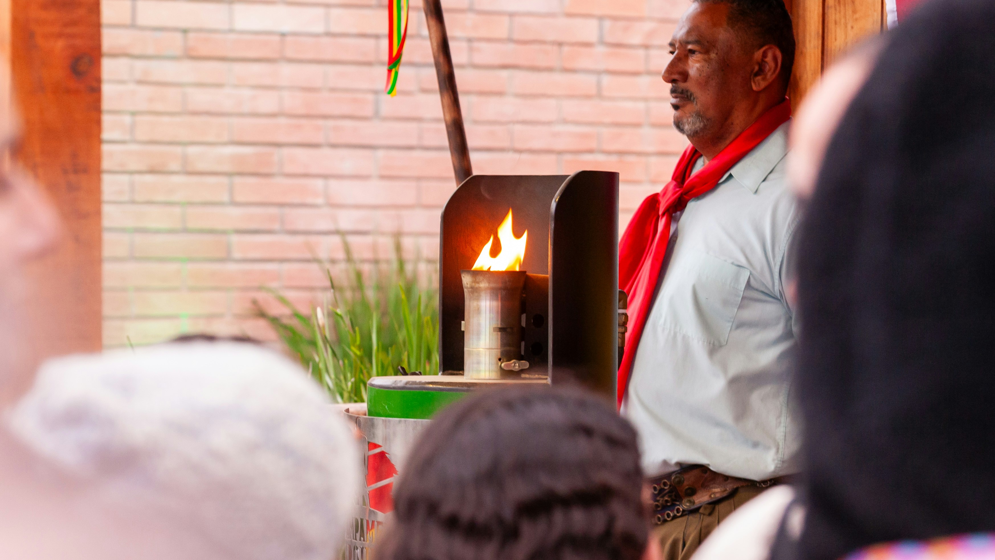 Flame at the Grill: A Portrait in Firelight and Community