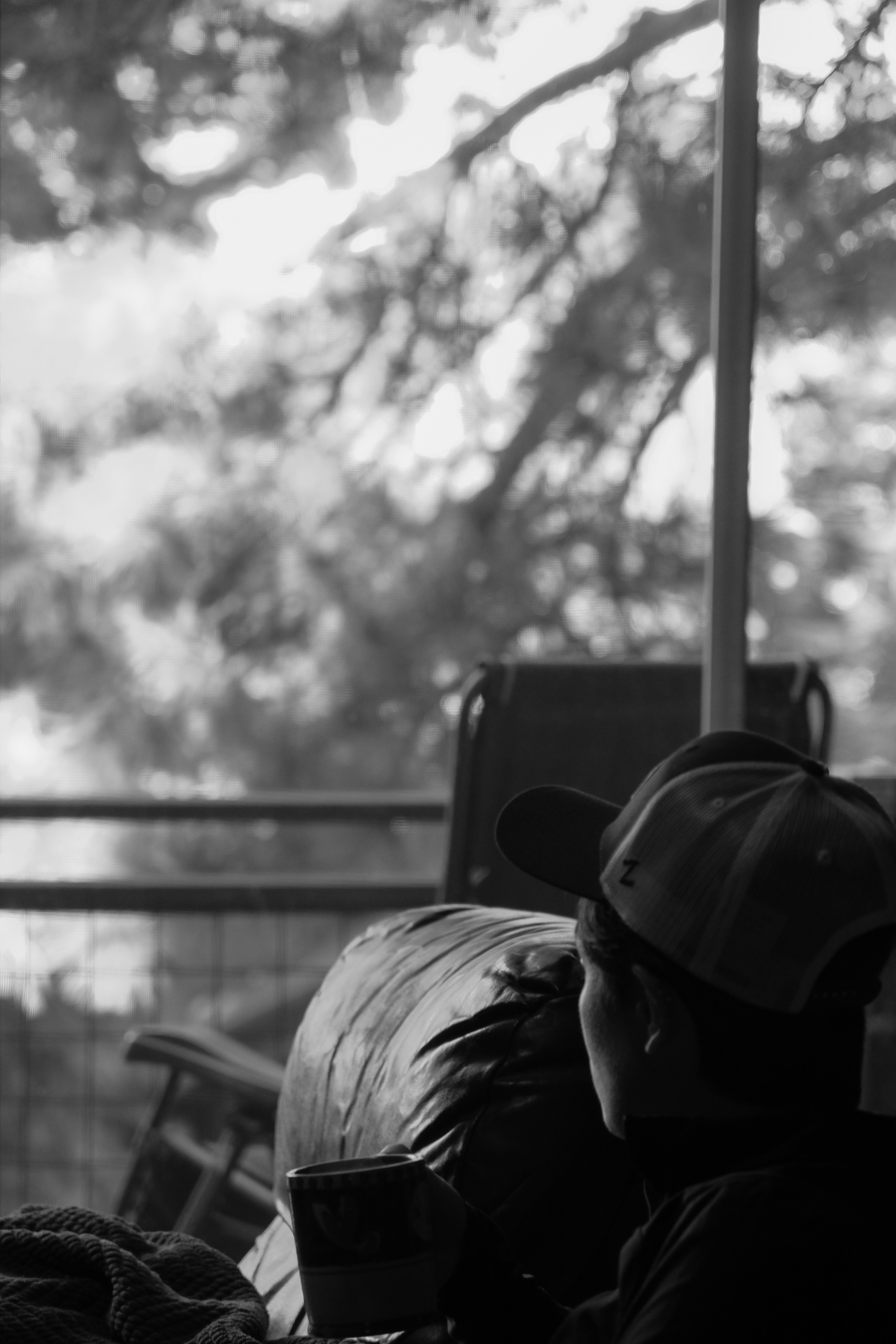 Shadowed Recline: A Quiet Moment on the Porch