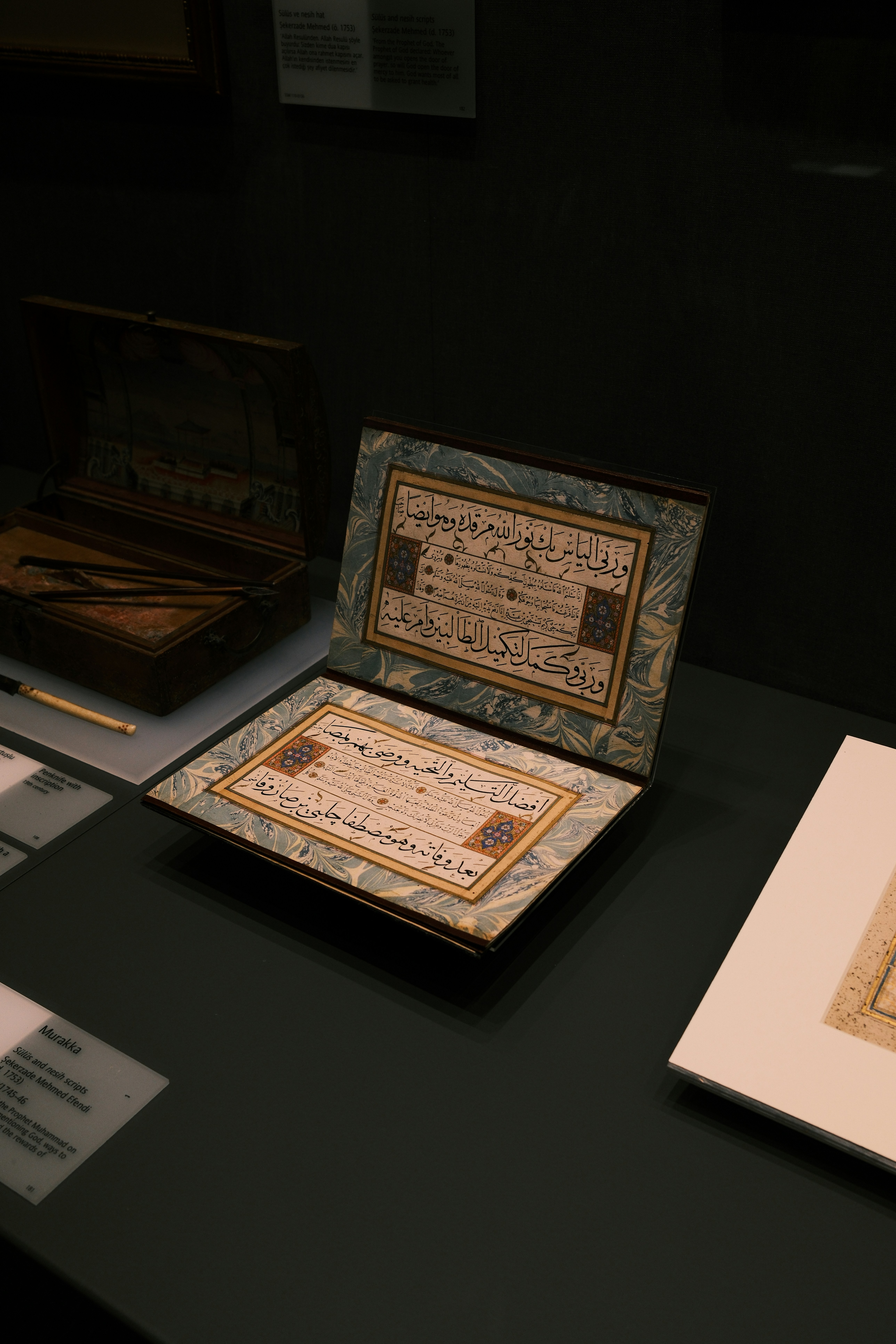 Framed Arabic Calligraphy Unfolding Across a Museum Display