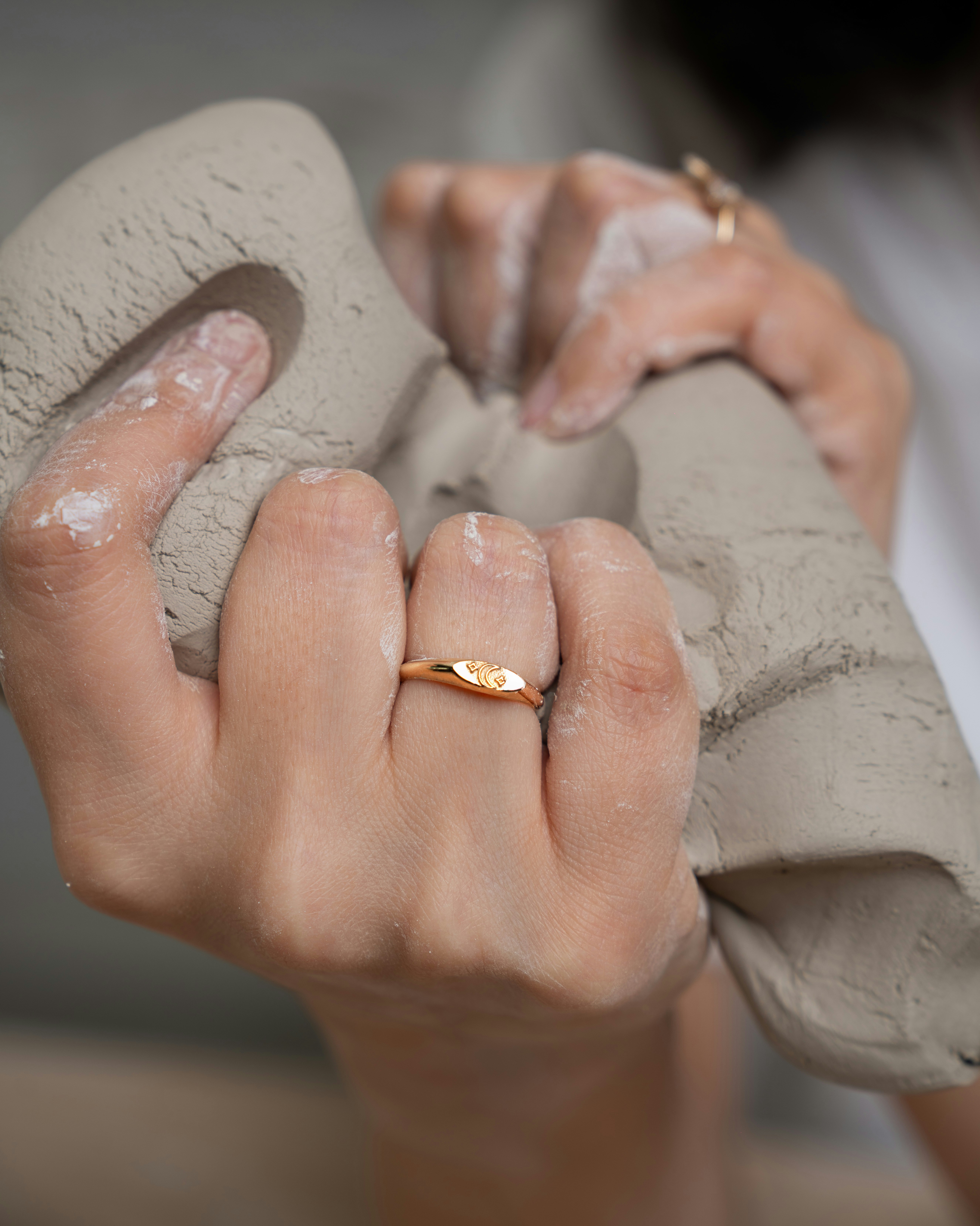 Hands at Work: Sculpting Clay by the Light