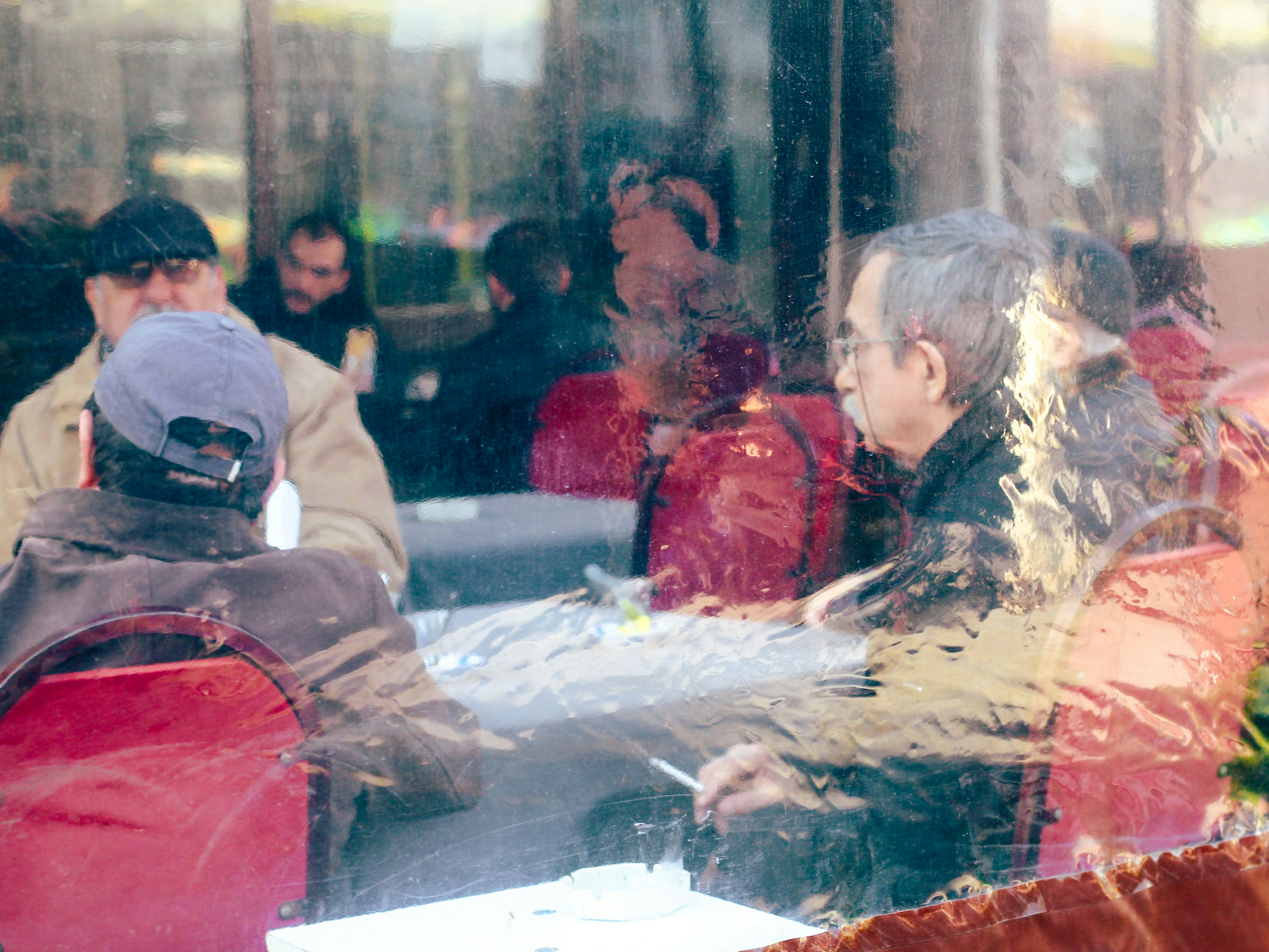 Converging Faces Through a Glassy Window