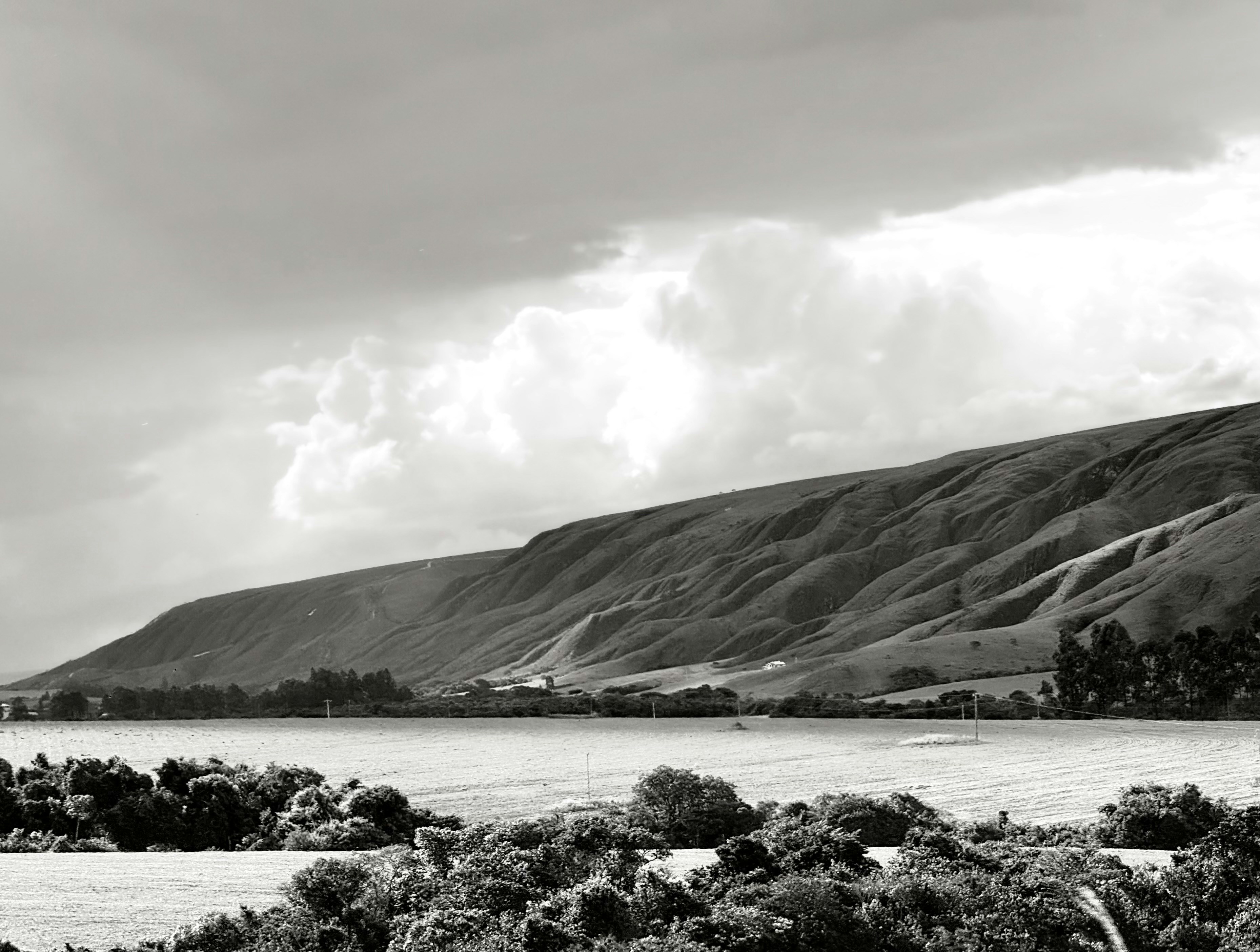 Quiet Rift: Hills Over a Serene Waterline