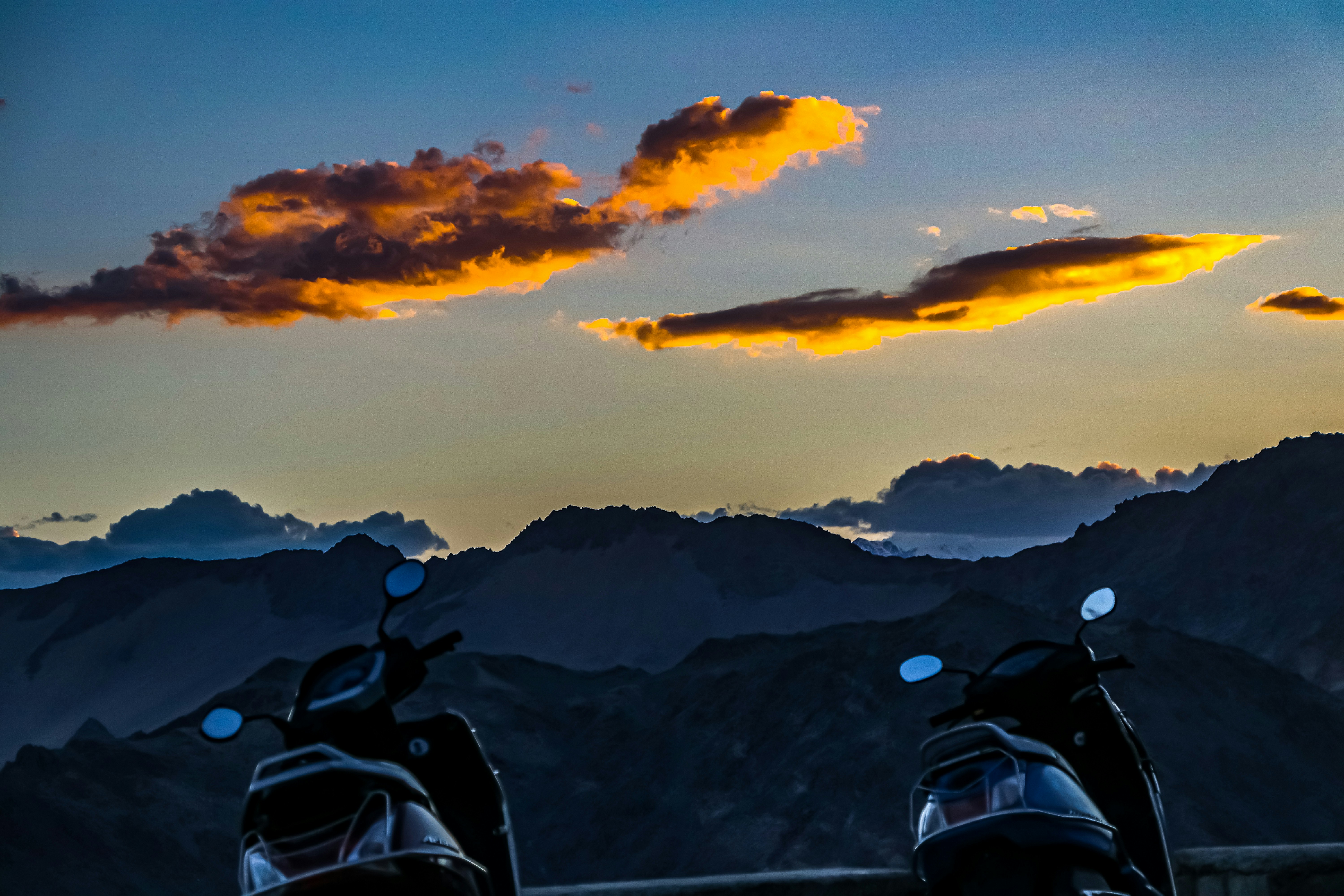Evening Ridge: Motorcycles Rest at Sunset Over the Valley