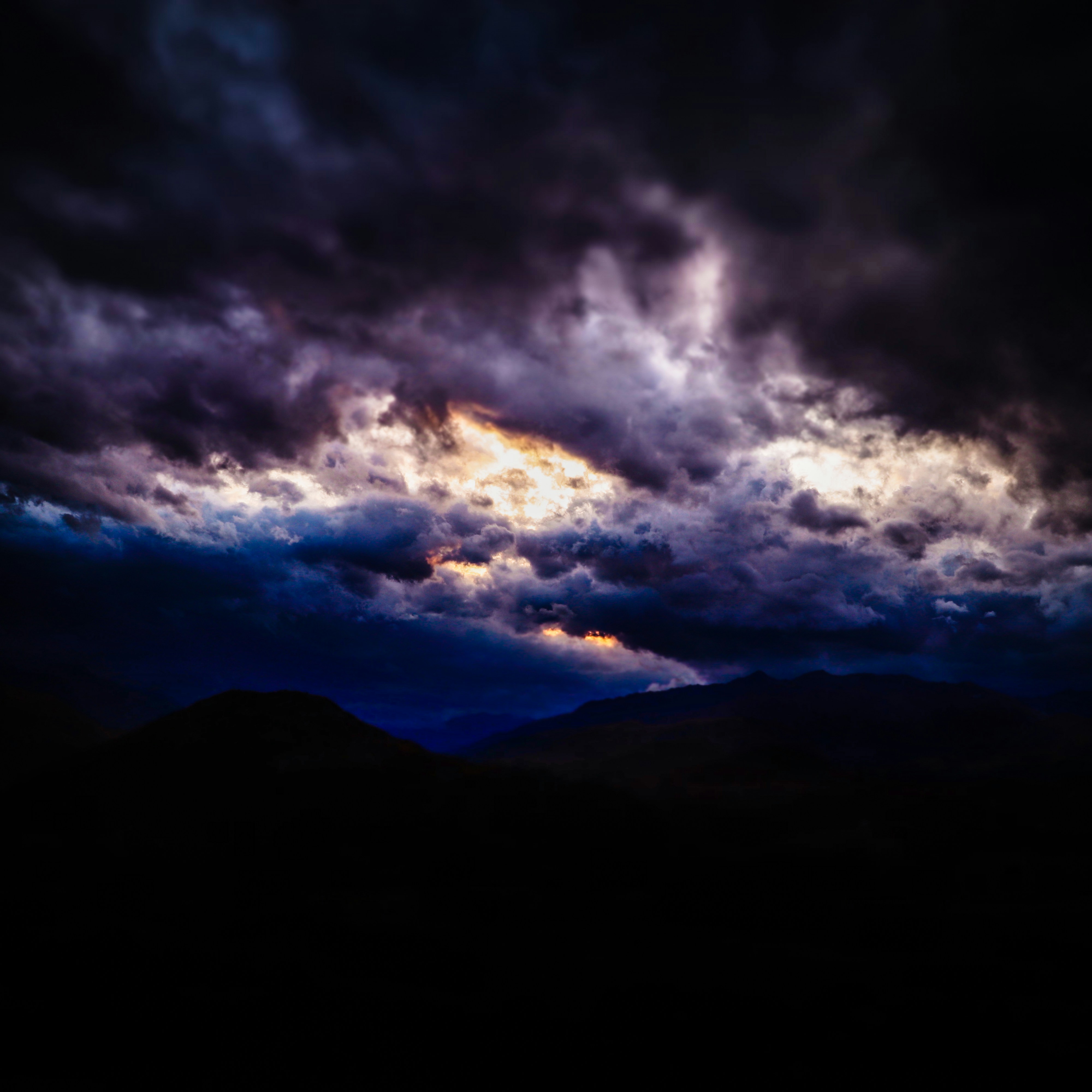 Storm-Scarred Horizon Over Silent Peaks