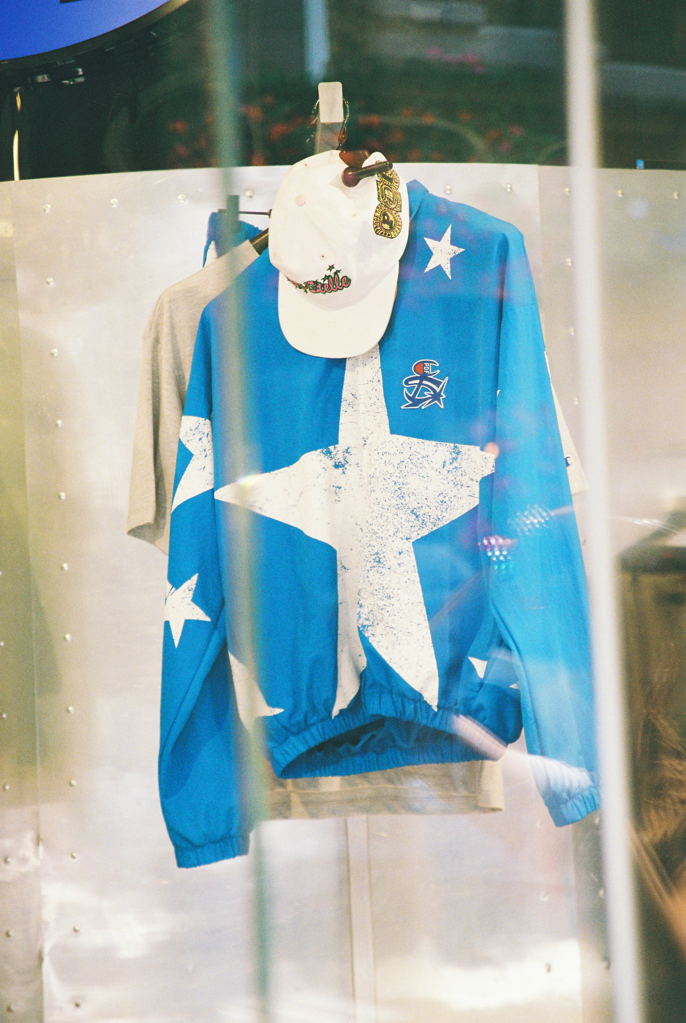 Stars, Caps, and a Blue Jacket: Streetwear Echoes in Glass