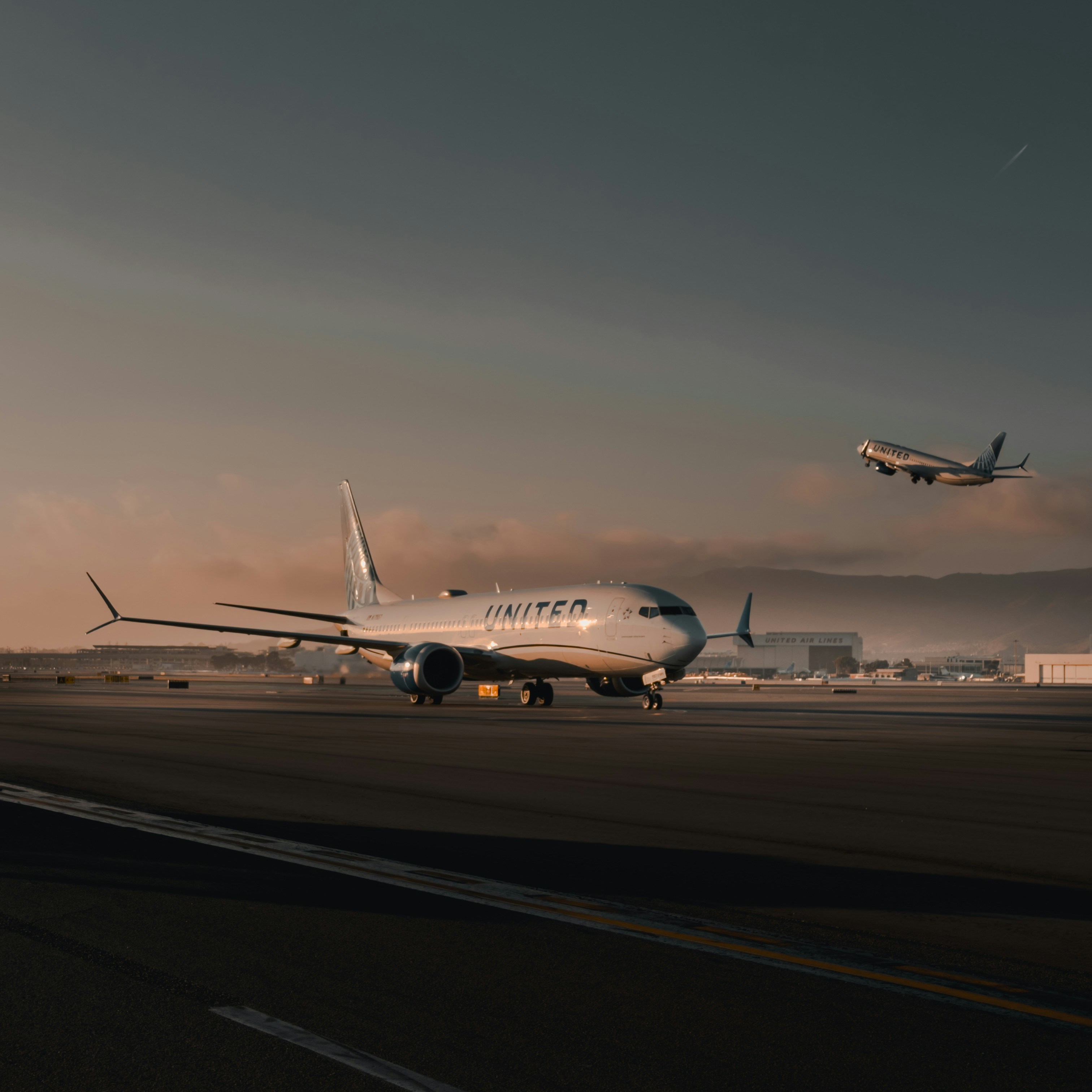 United in the Sunset: A Twin-Engine Takeoff at Dusk