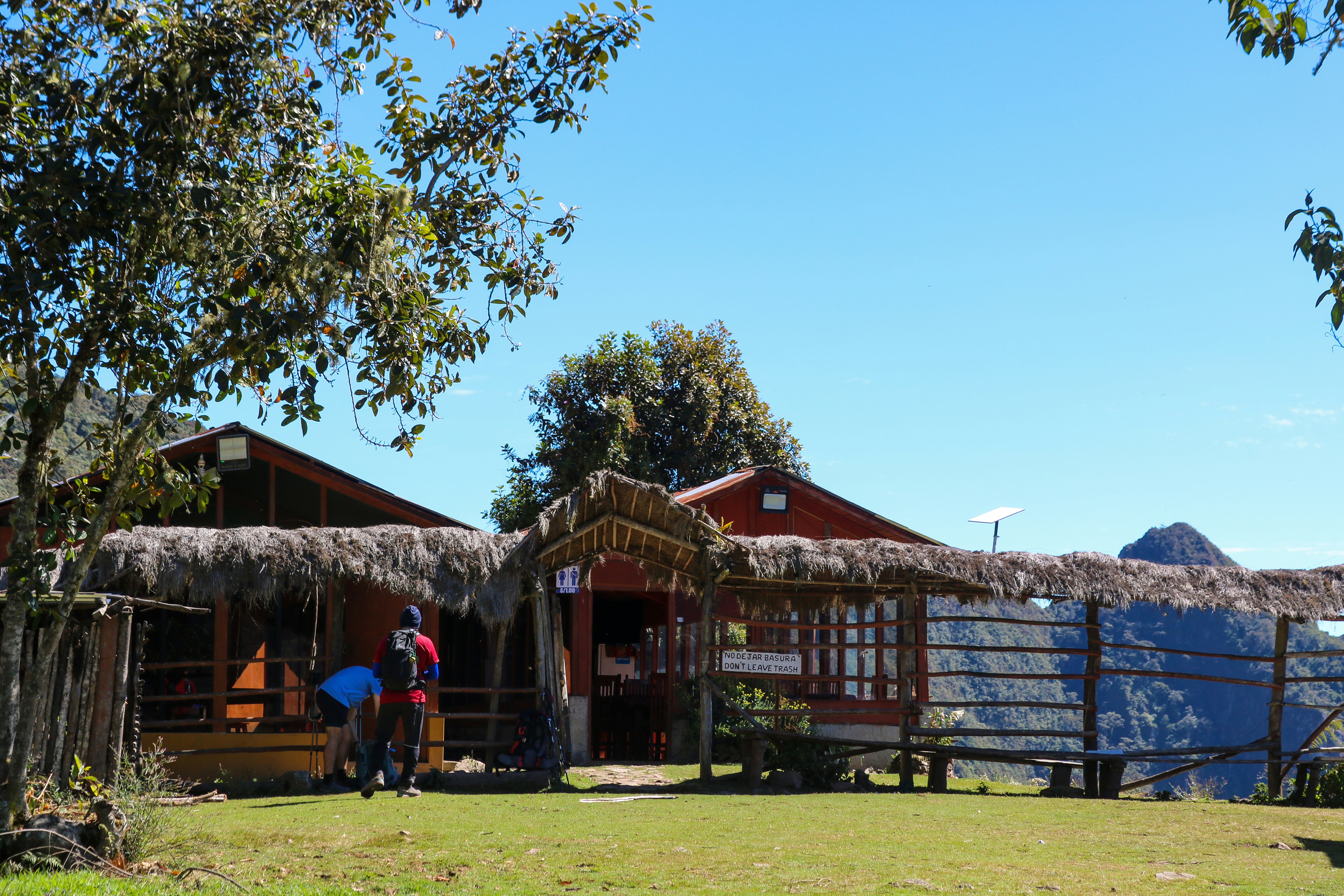 Thatched-roof Cottages by the Cliffside Village