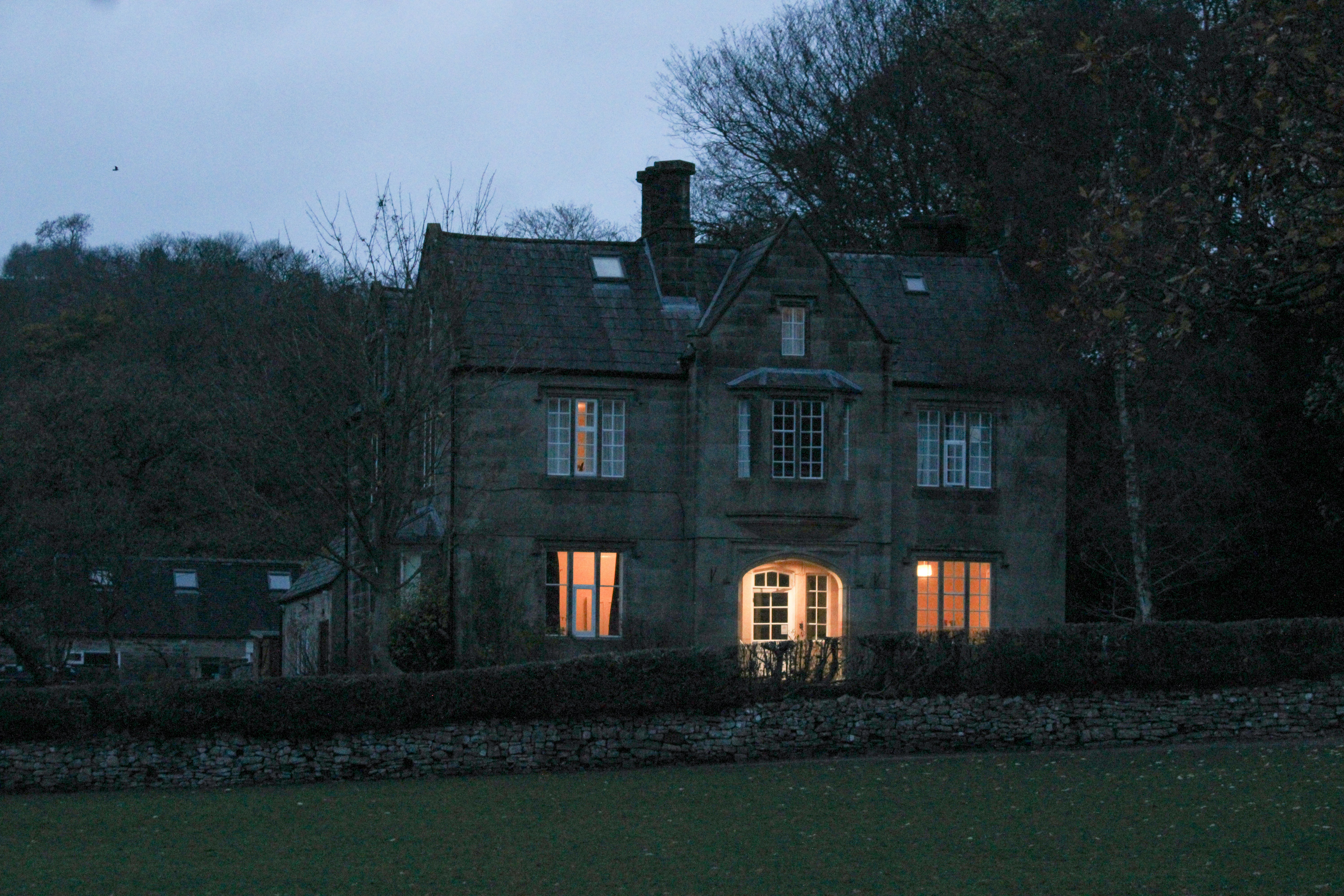 Moonlit Manor: Warm Light in a Quiet English Wake
