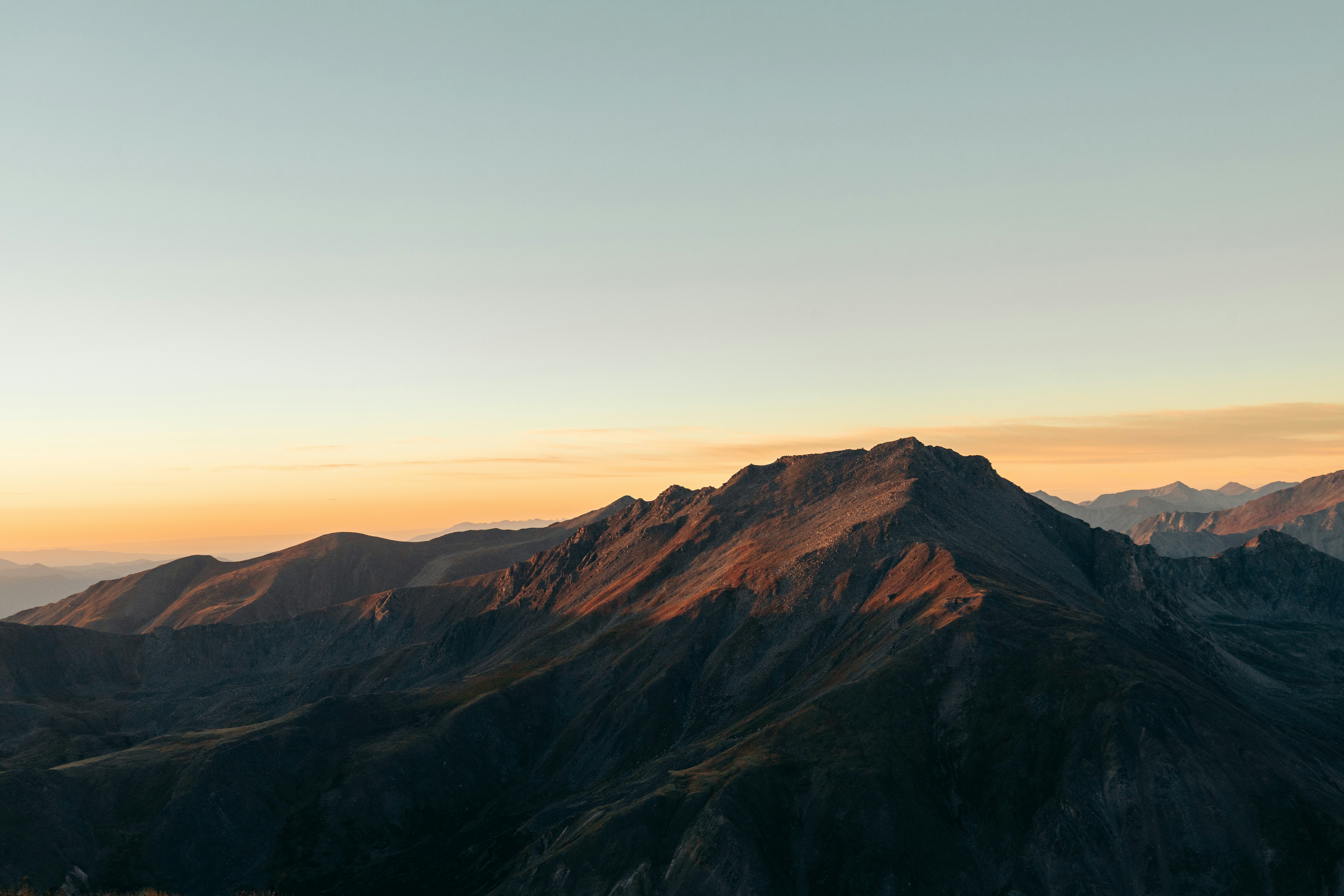 Dawn Crest: A Quiet Summit Bathed in First Light