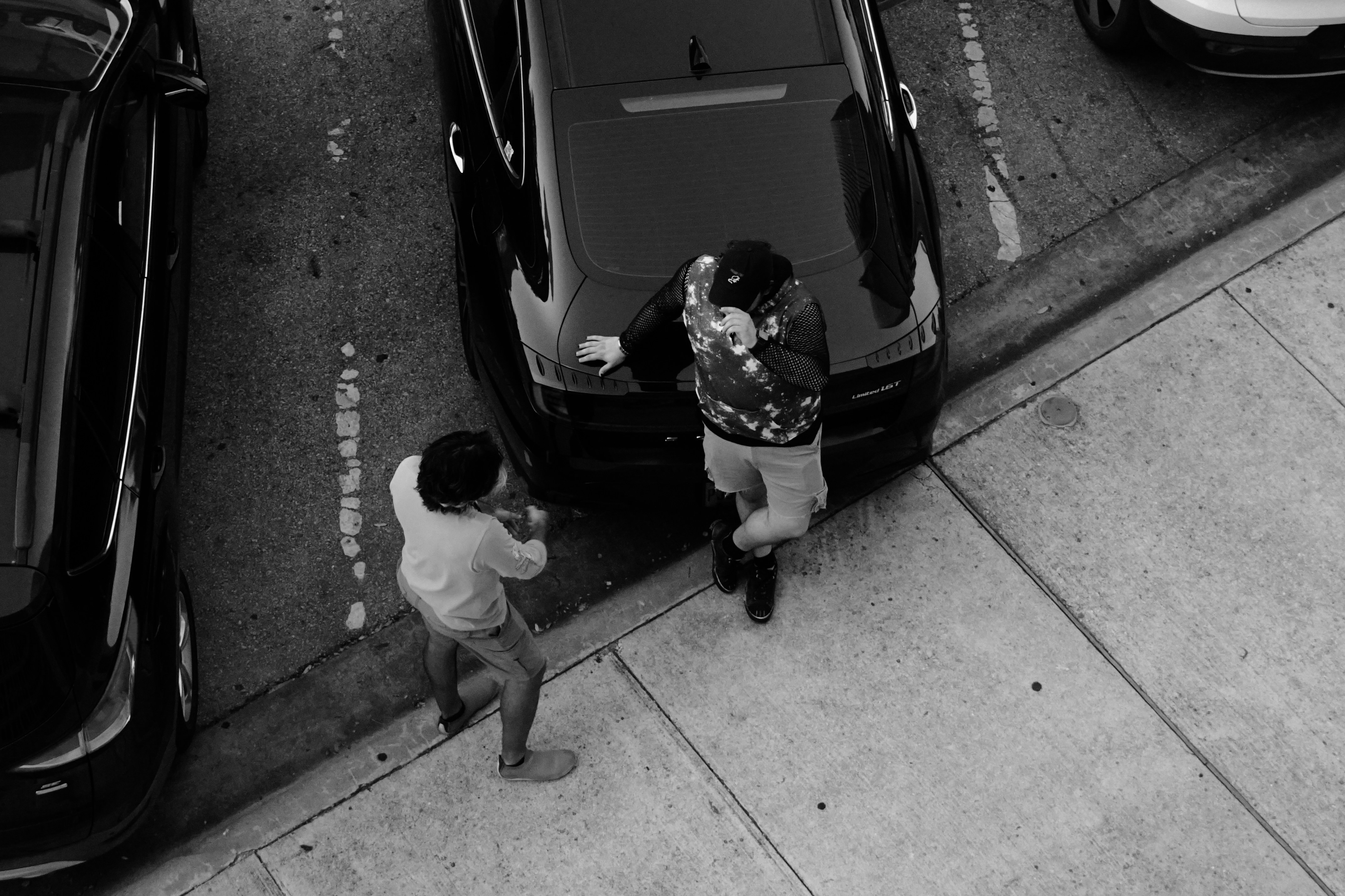 Two Figures on a City Street: A Moment Between Strangers