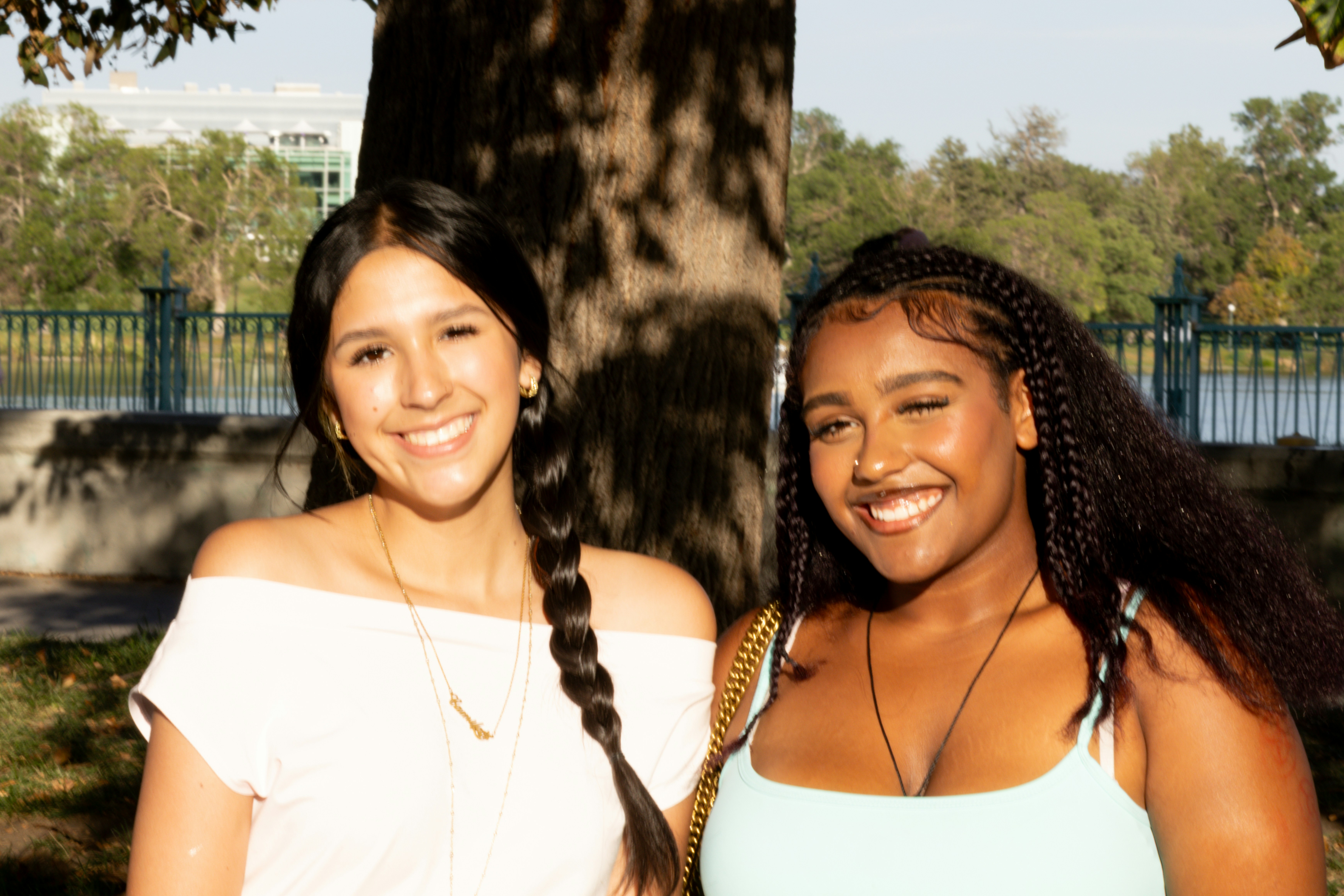  dual smiles under a leafy shade