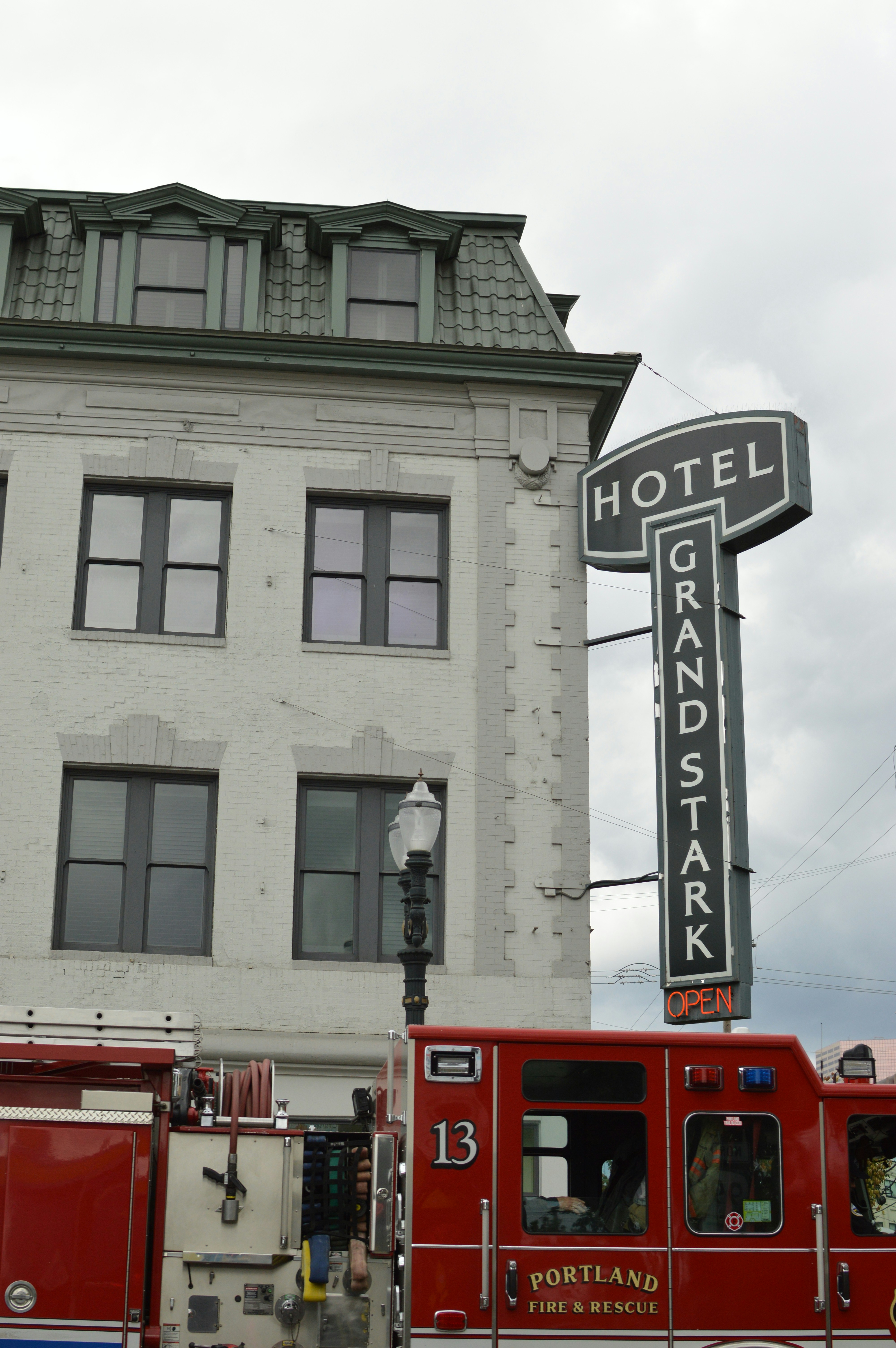 Firetruck at the Grand Street Hotel: A City Scene in Red and Brick