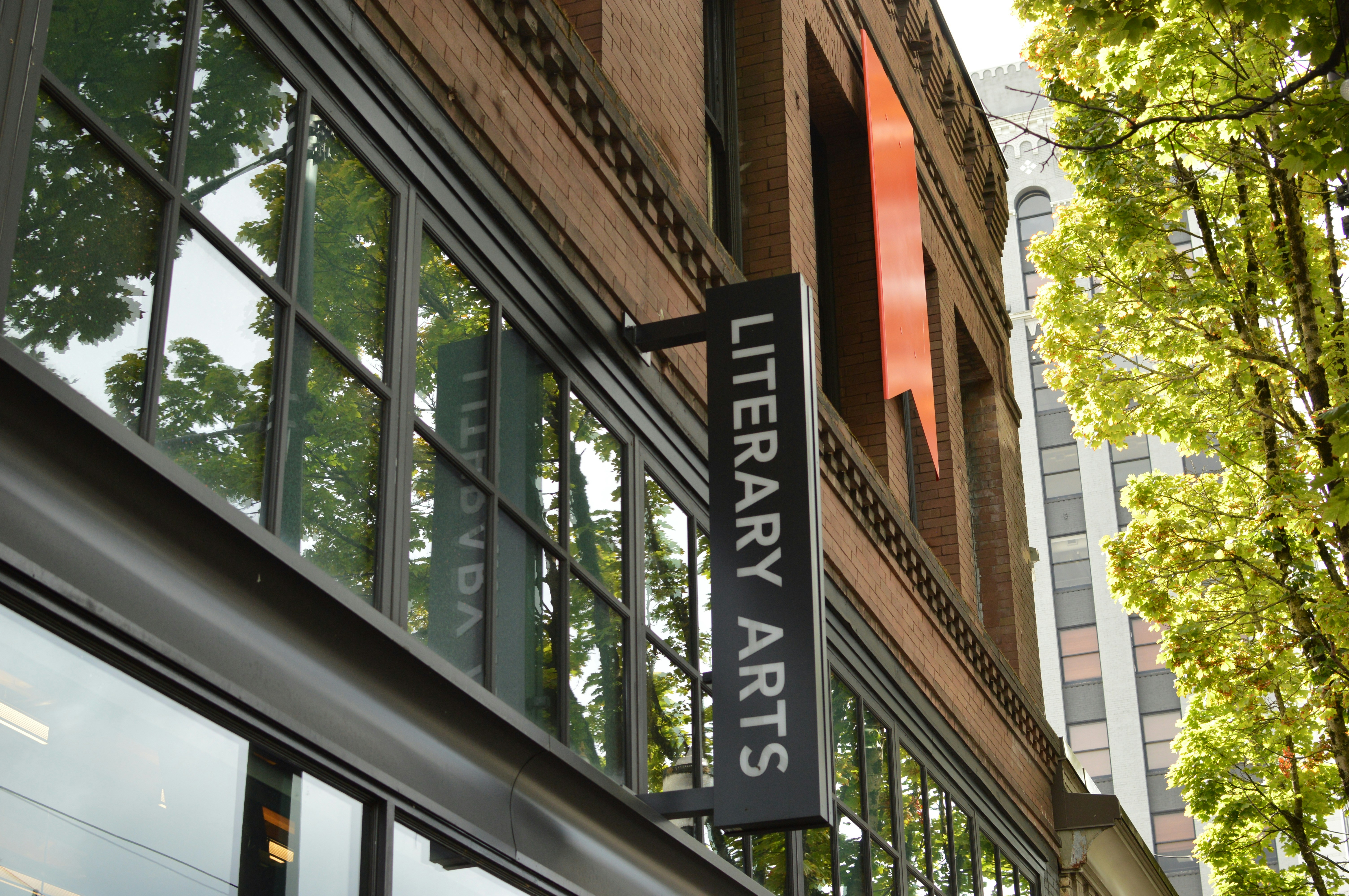 Literary Streetfront: A Library Sign Anchoring the Urban Façade