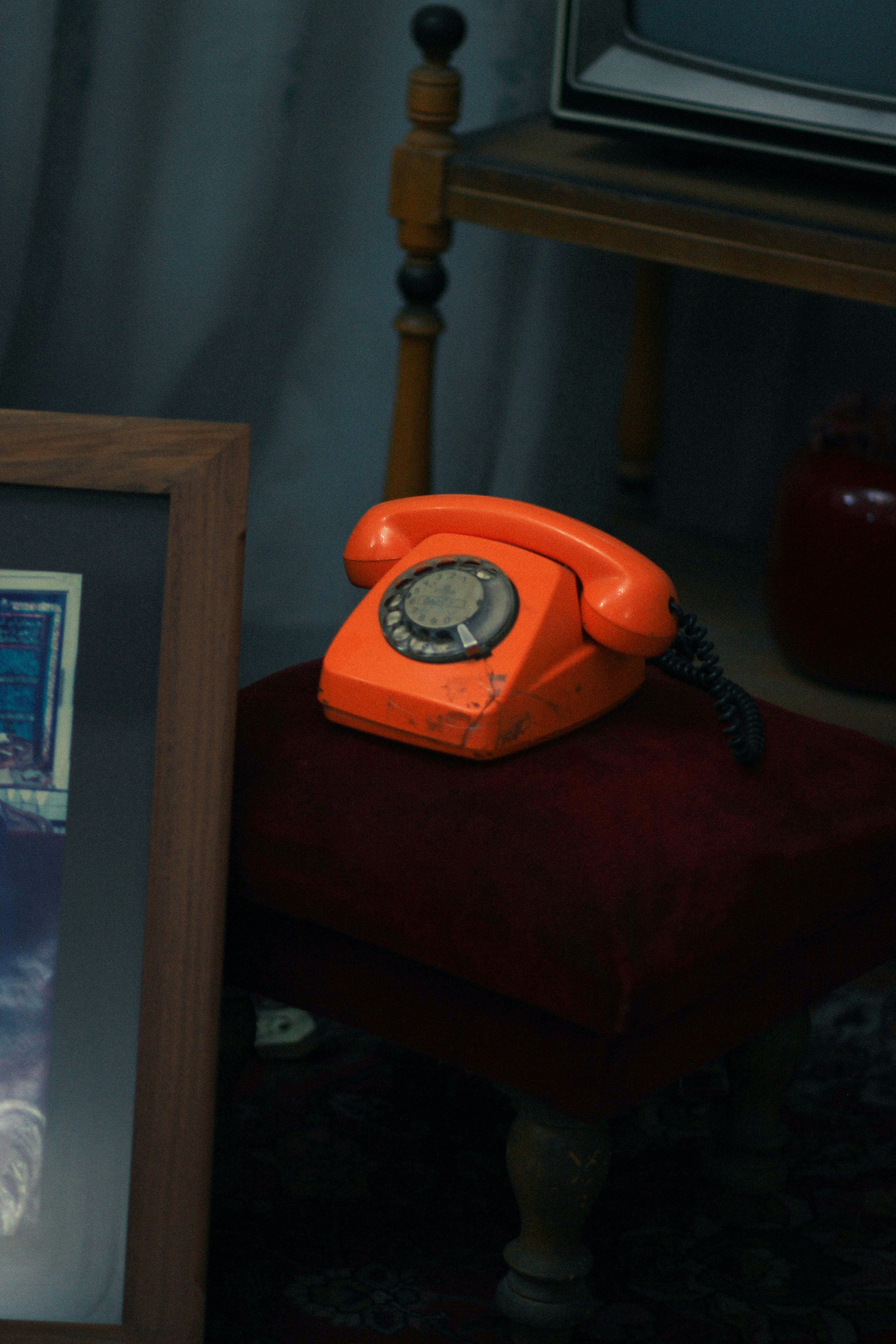 Orange Rotary: A Vintage Dial on a Quiet Nightstand