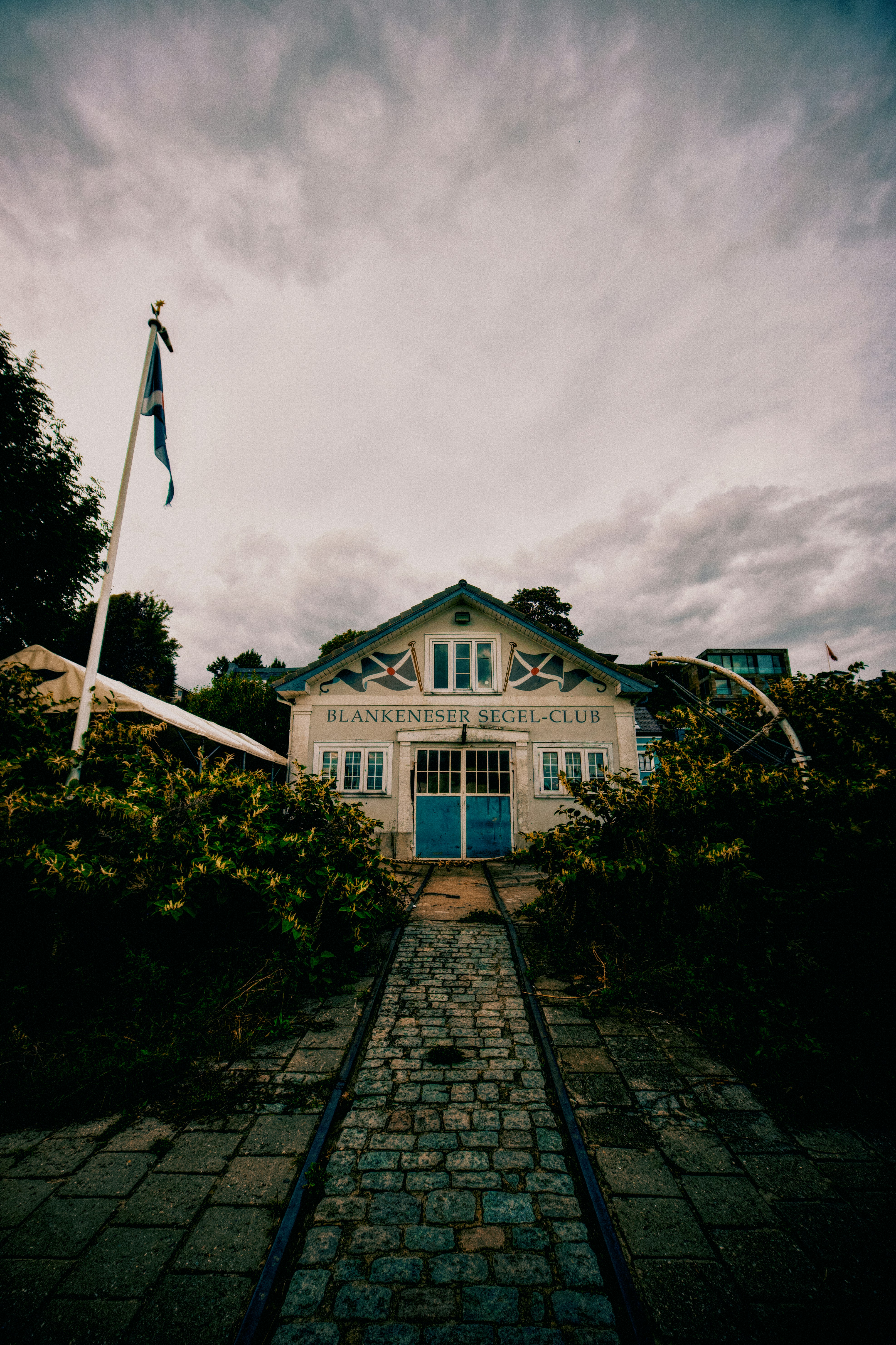 Toward the Blue Doors: Pathway to the Blankeneser Clubhouse
