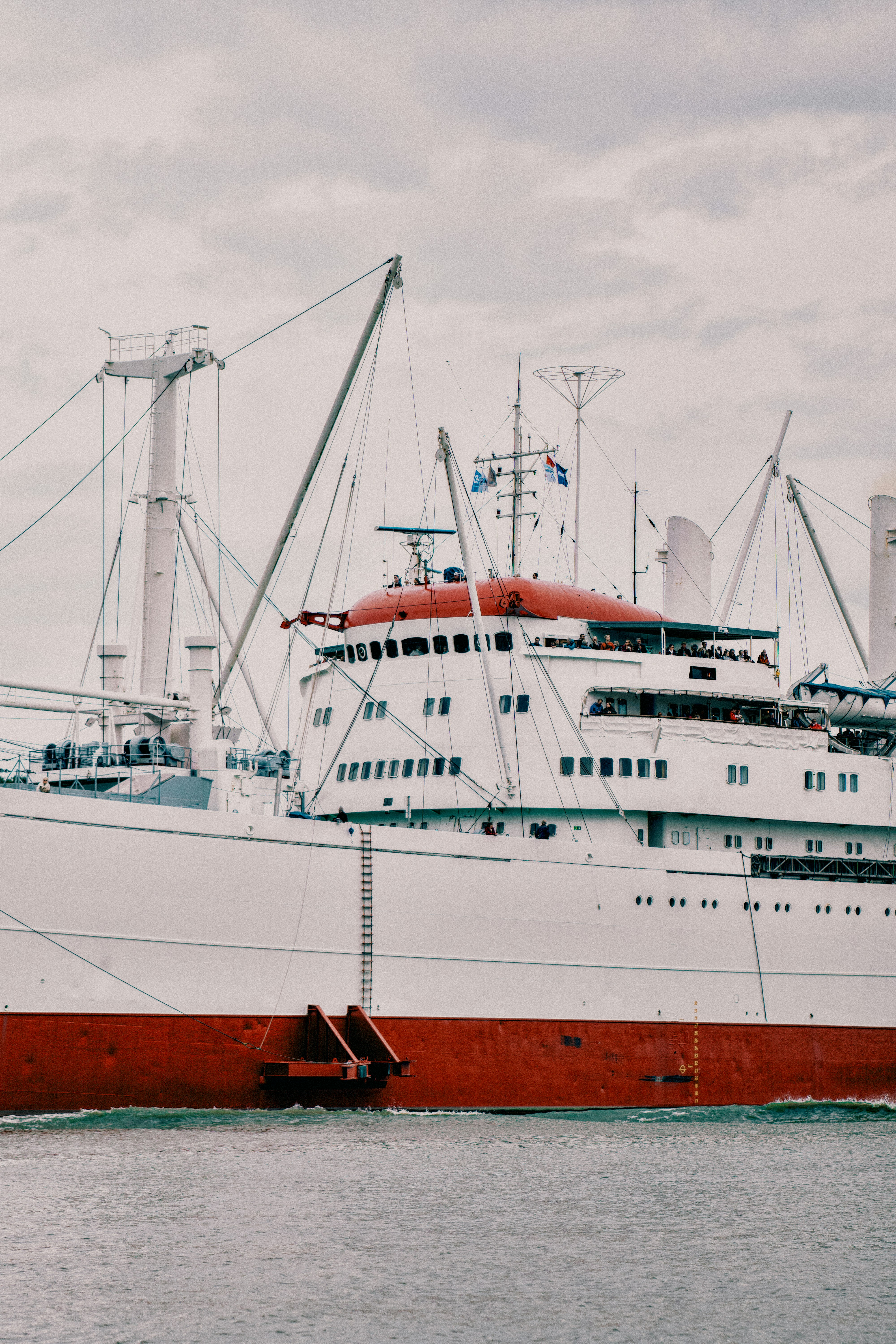 Midday Majesty: The White Cruise Ship Rises Above the Waterline