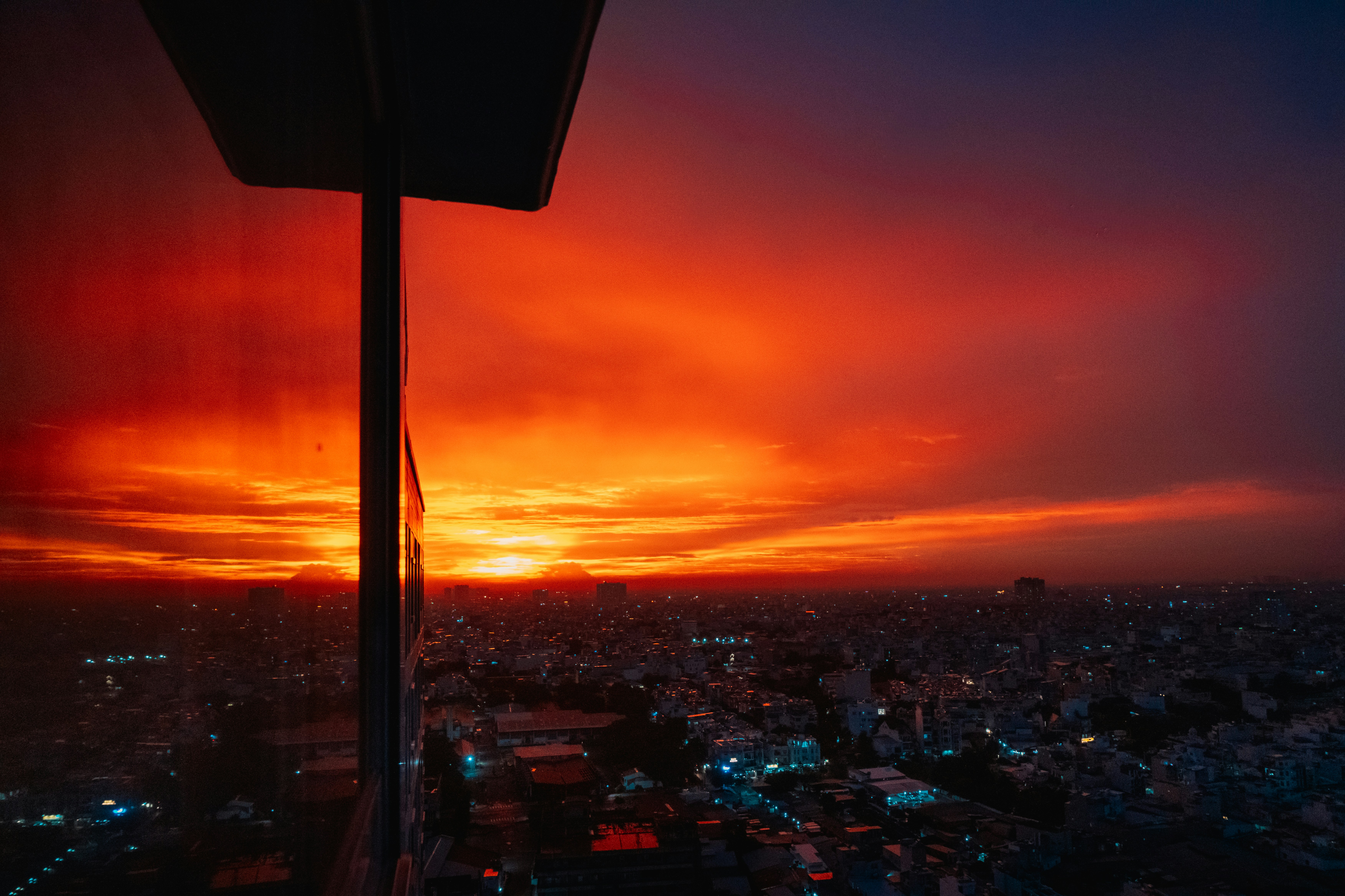 Crimson Horizon Over a Distant City