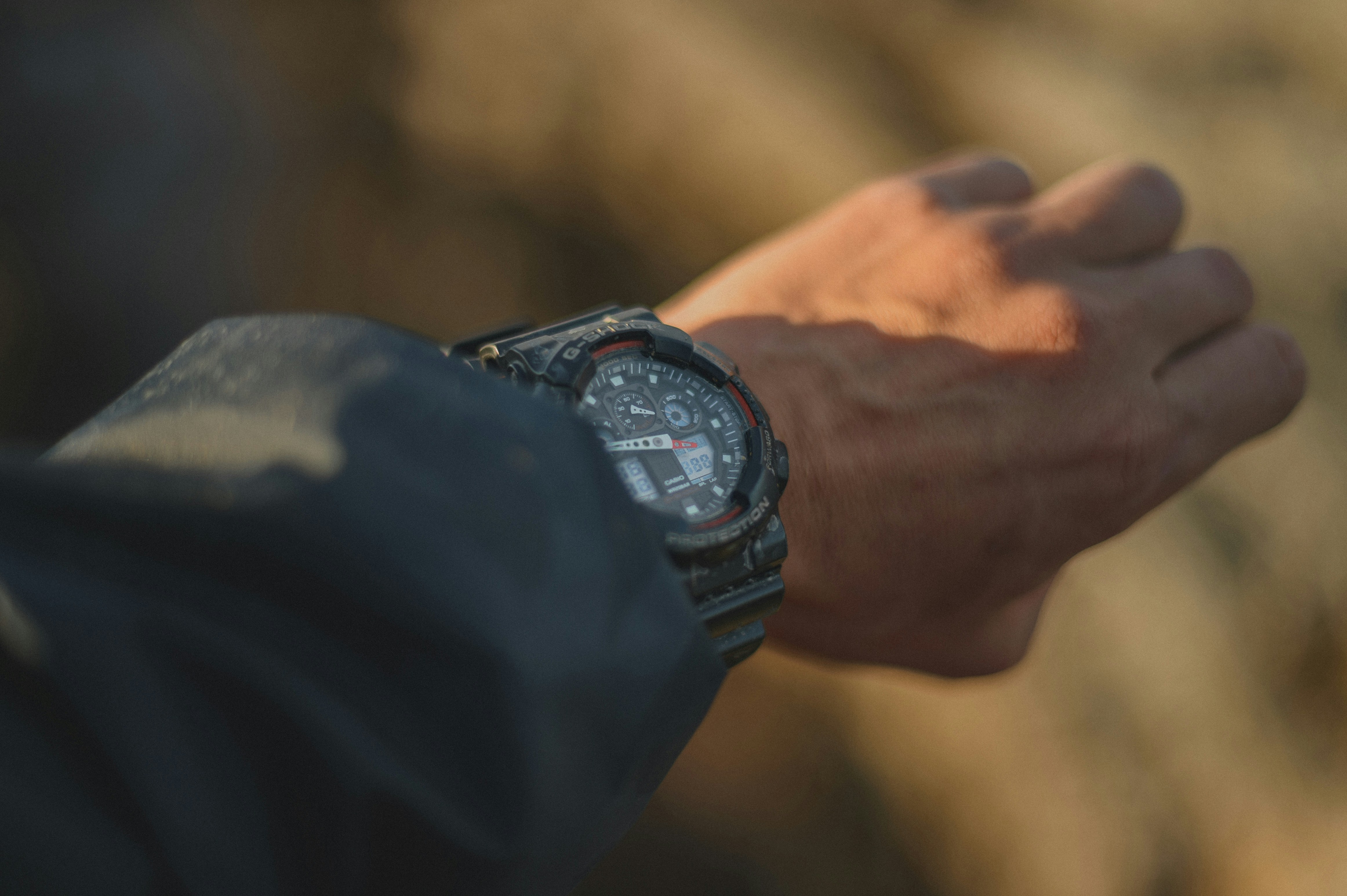 Wristwatch in focus as morning light softens the scene